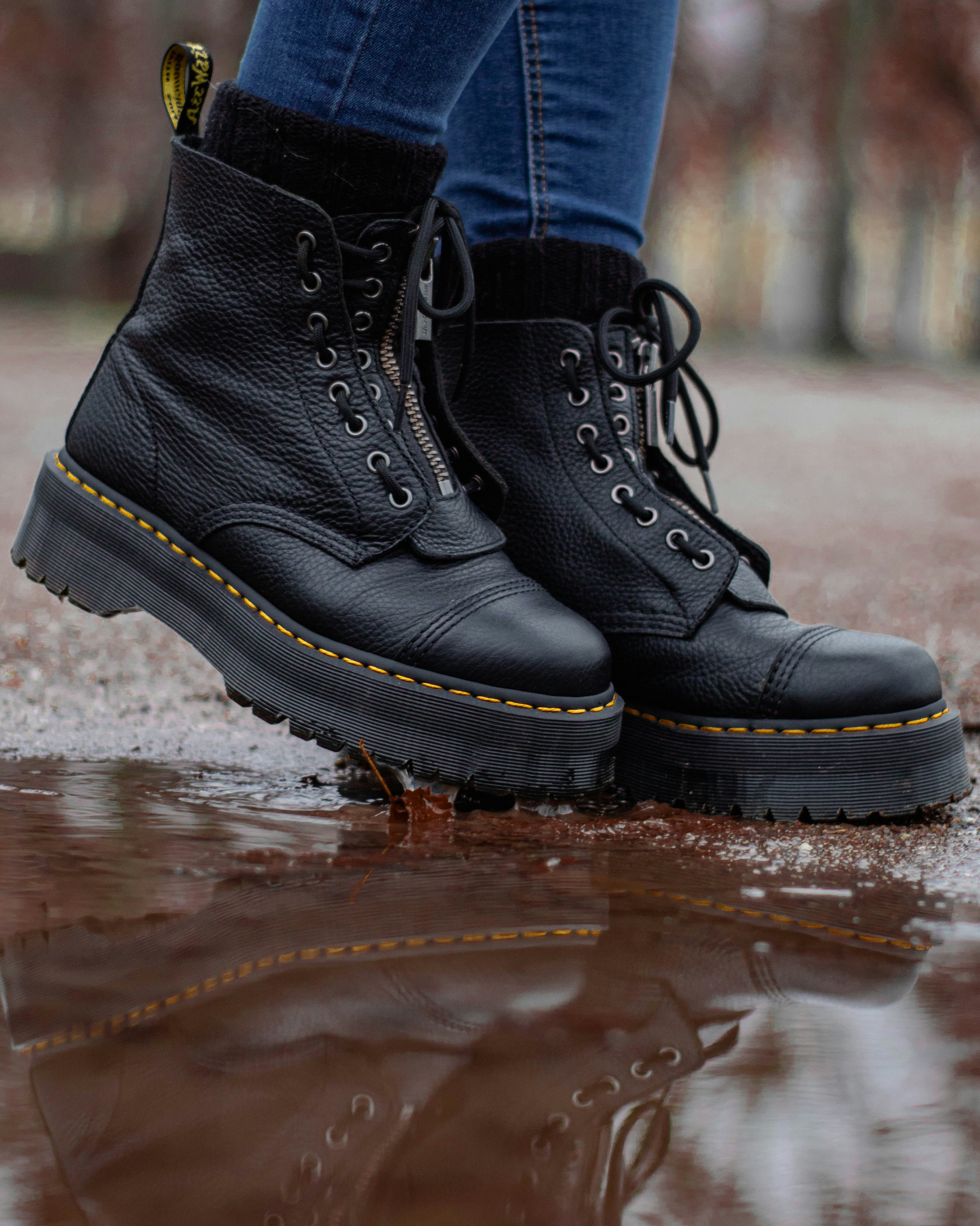 Person wearing black leather boots photo – Free Human Image on Unsplash
