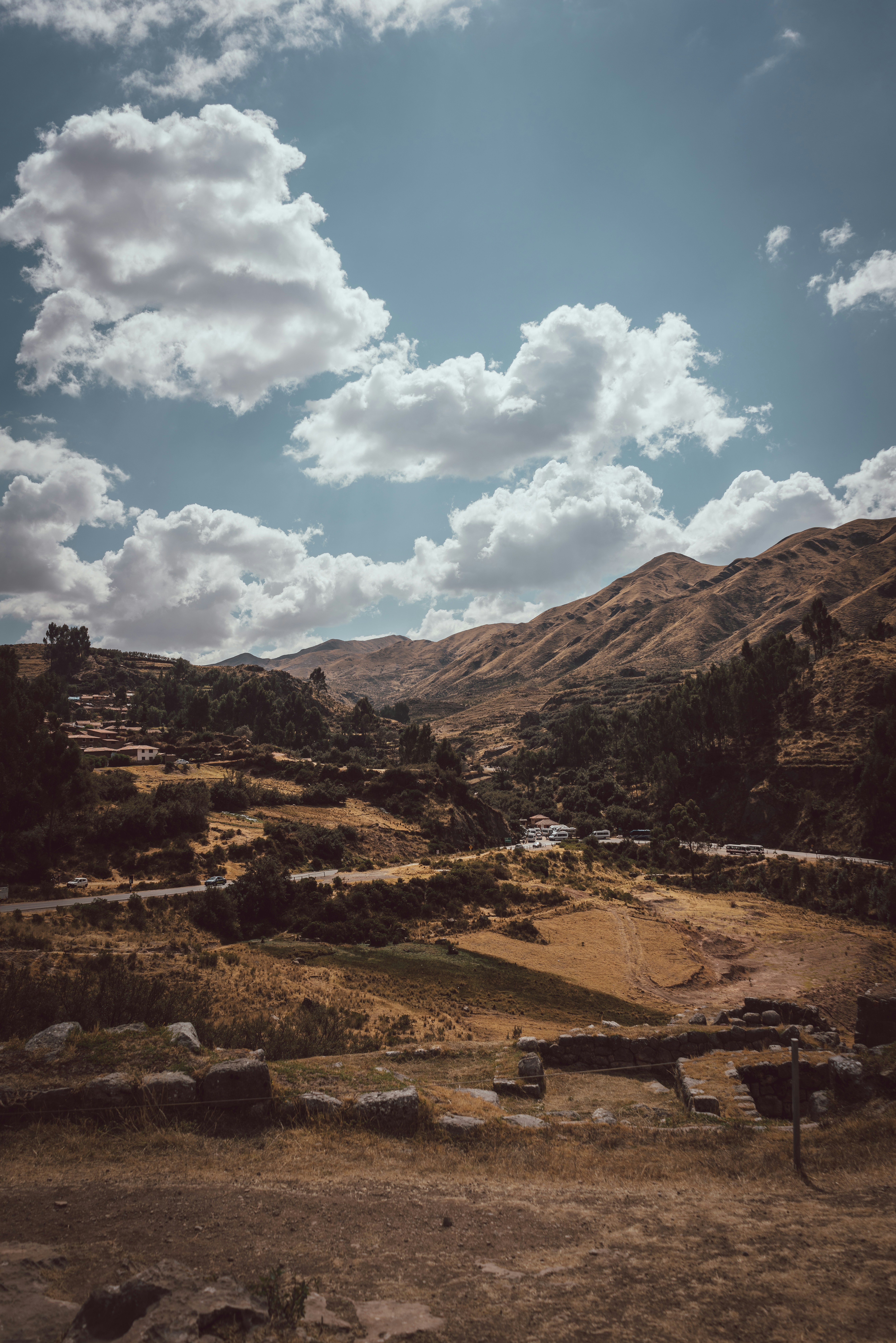 Ruined Terraces and Golden Hills Framed by a Cloud-Dusted Sky