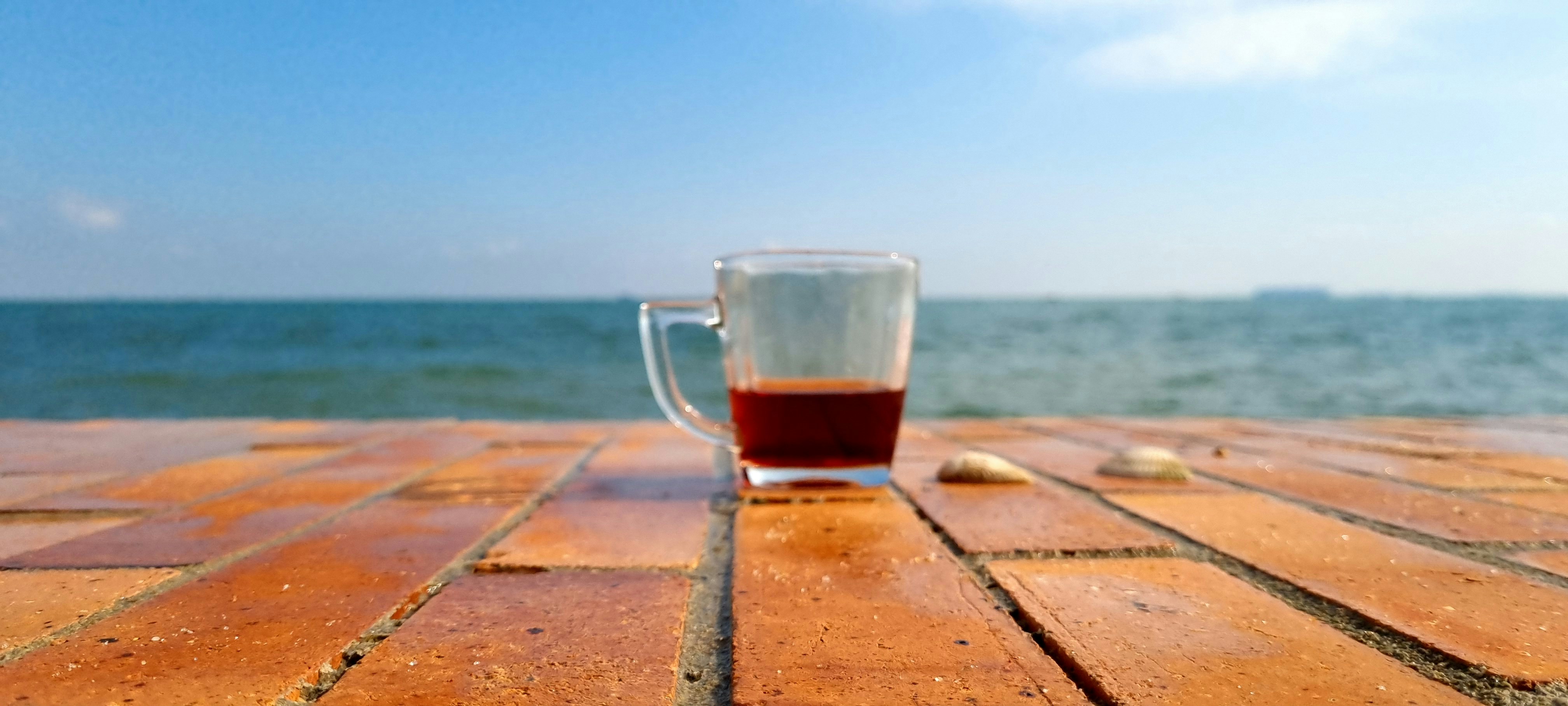 Minimalist Coffee at the Edge of the Ocean