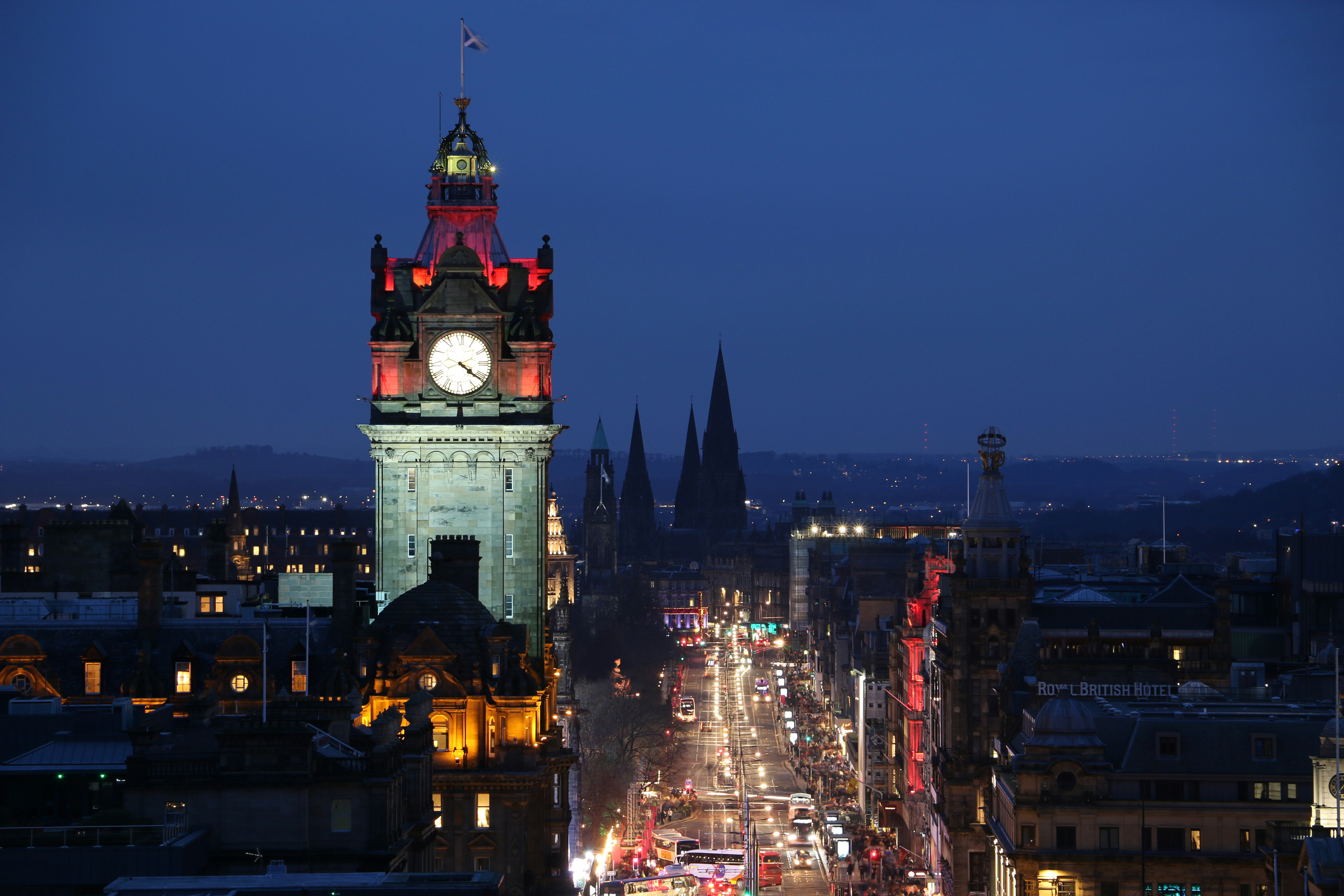 Clock Tower Crowned by Neon: Velvet Blue Hour over a City Street