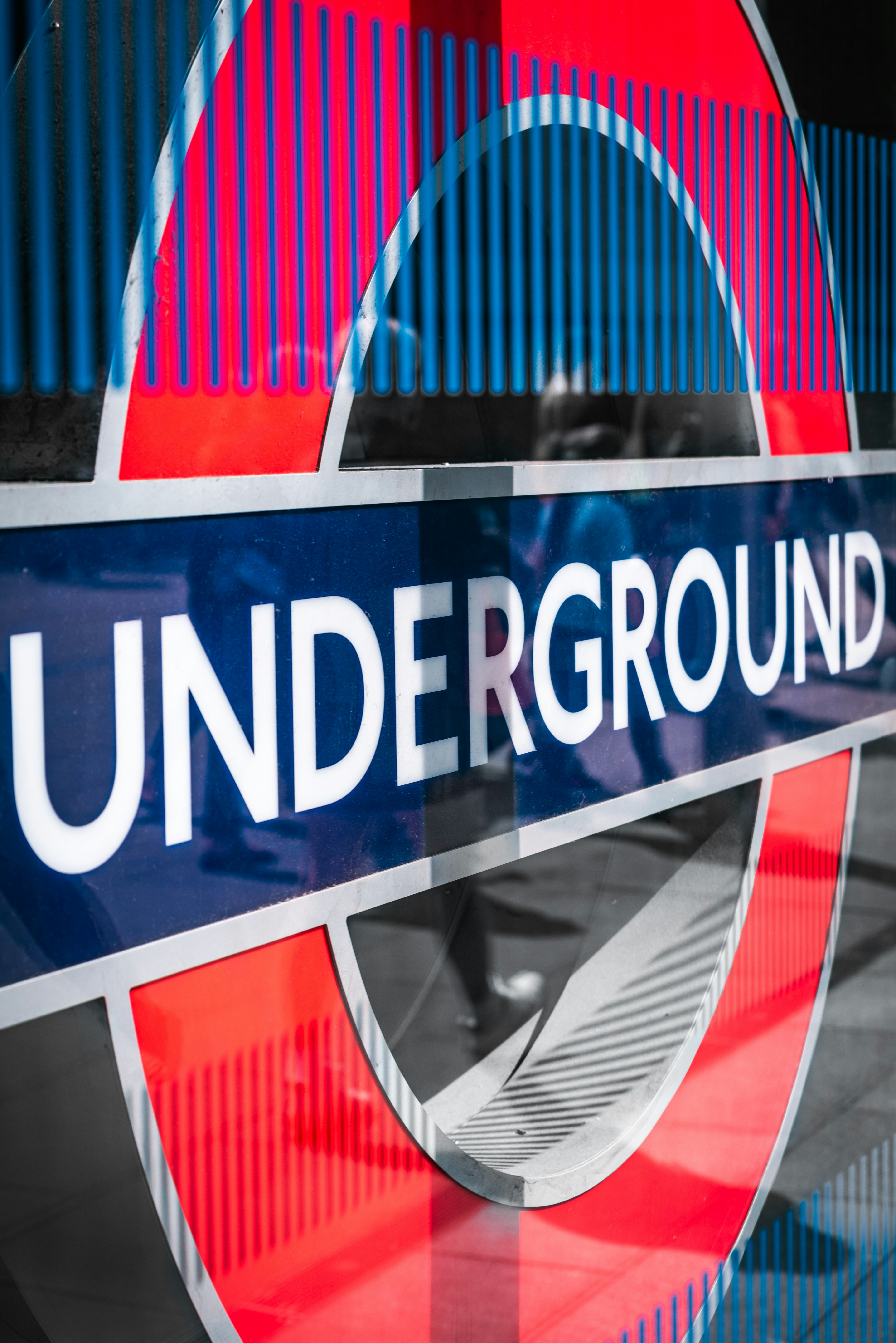 Striped Glass and Roundel: Close-Up of London's Underground Emblem