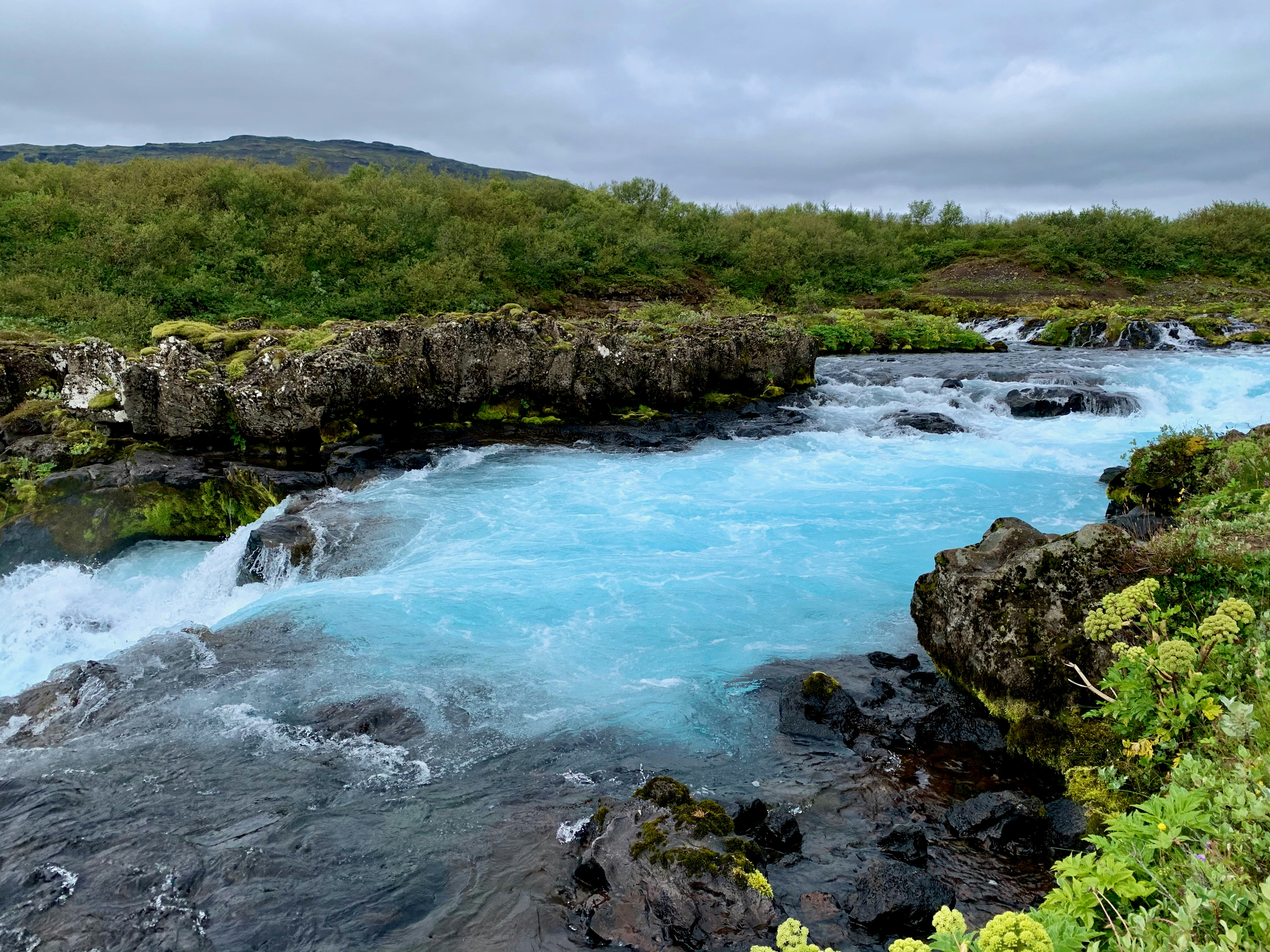 Turquoise Rapids Beyond Verdant Banks
