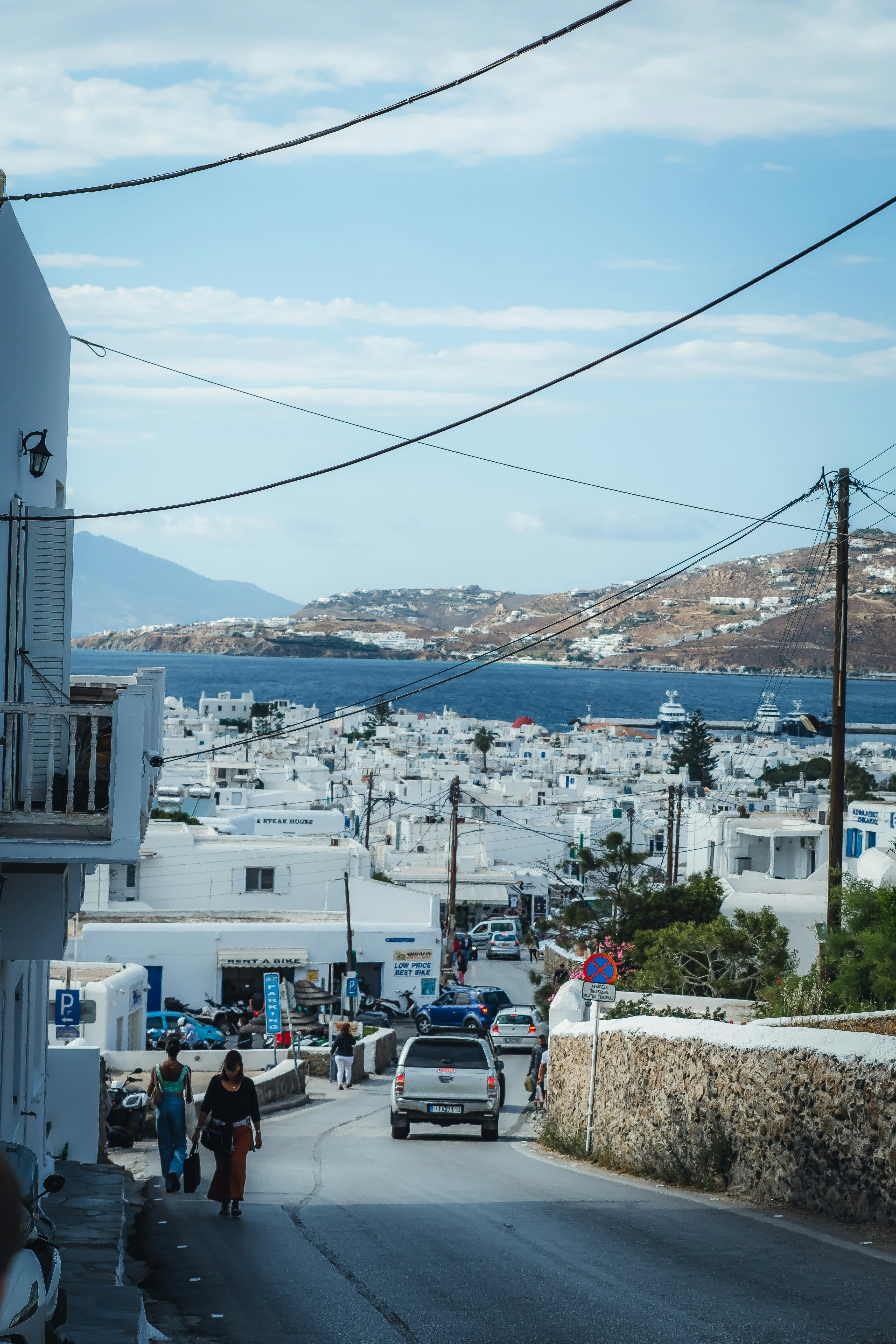 Whitewashed Streets Toward a Blue Aegean Horizon