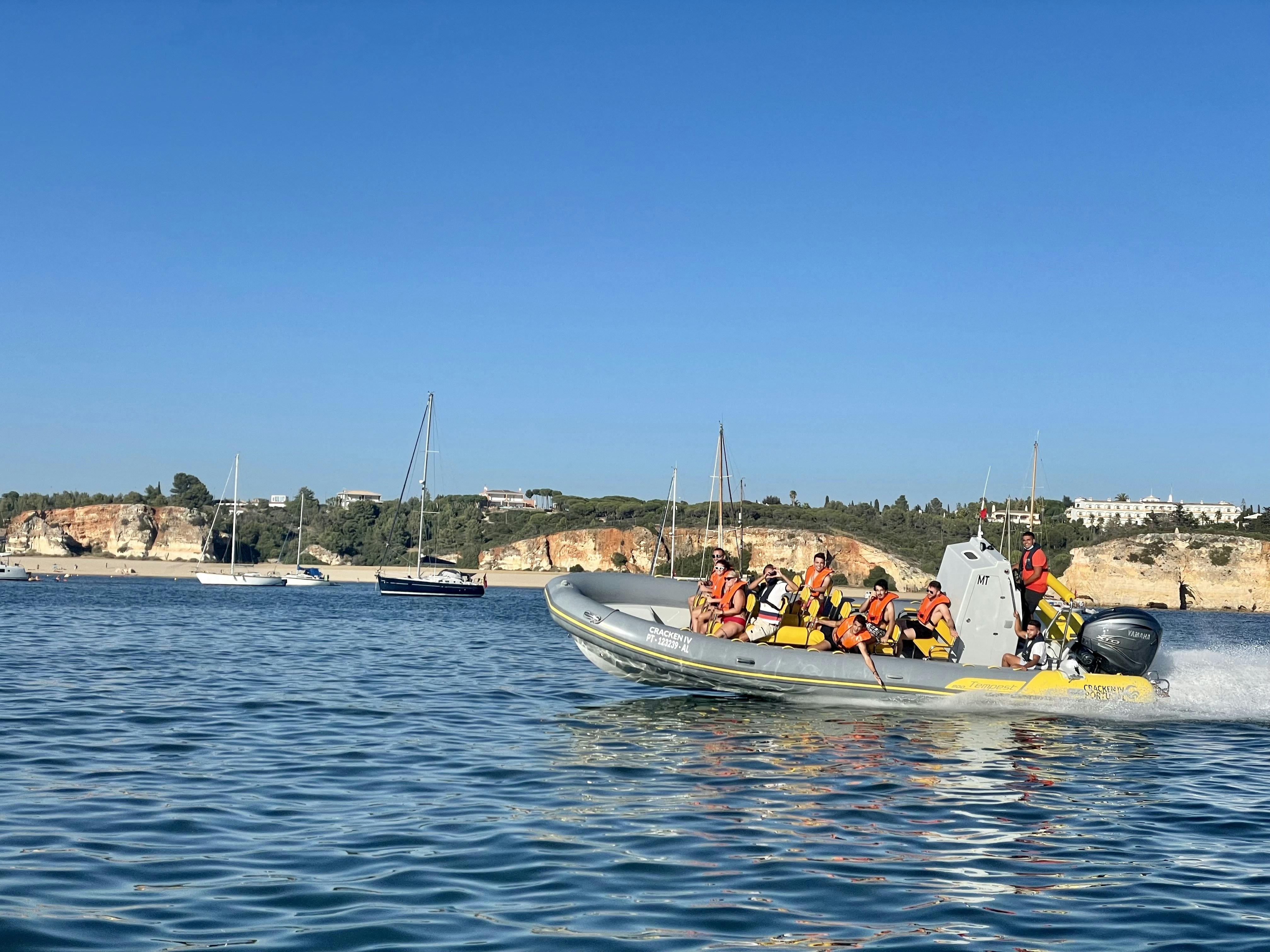 People riding on white and orange boat during daytime photo – Free ...
