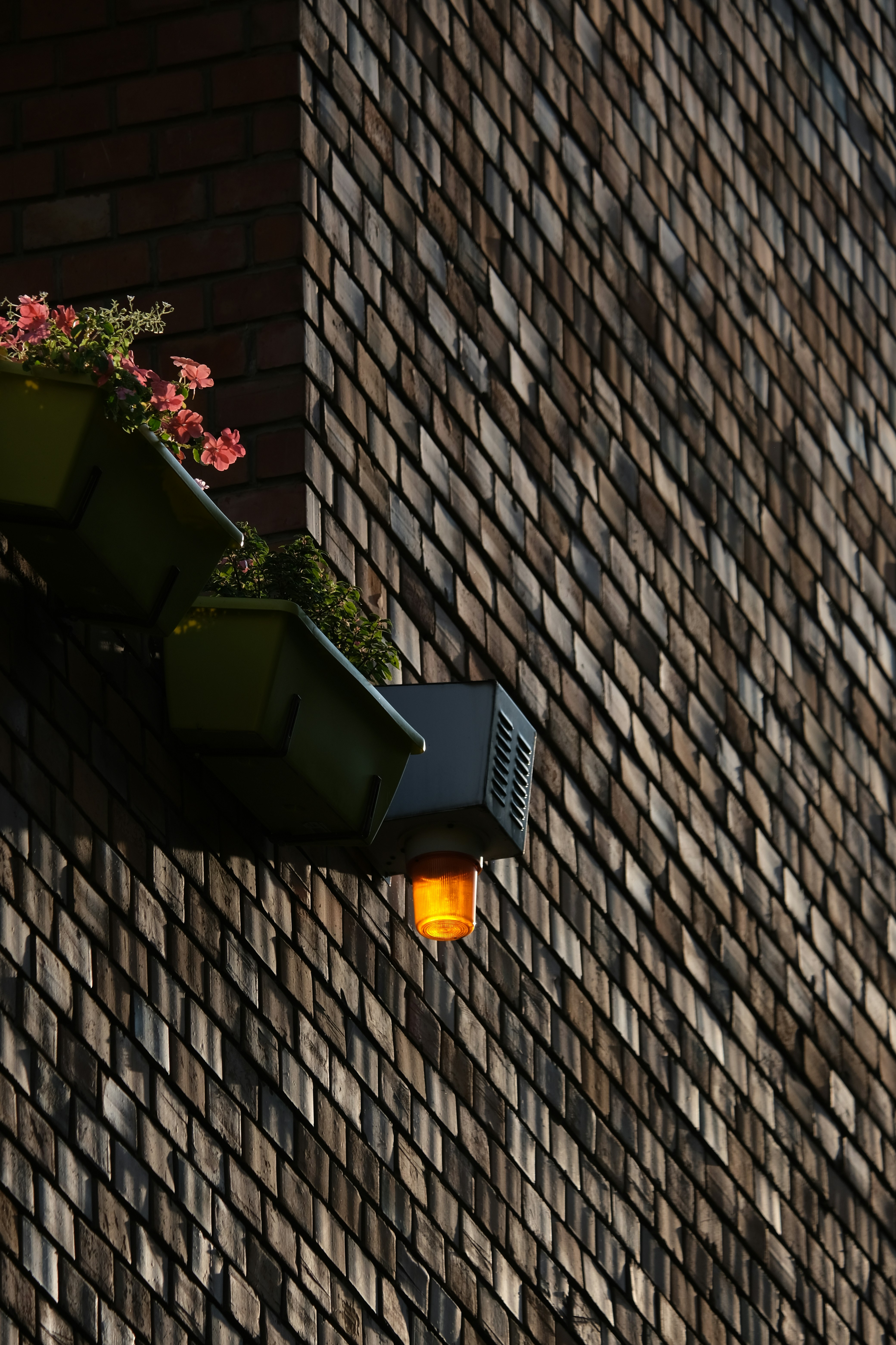Amber Beacon on a Brick Facade
