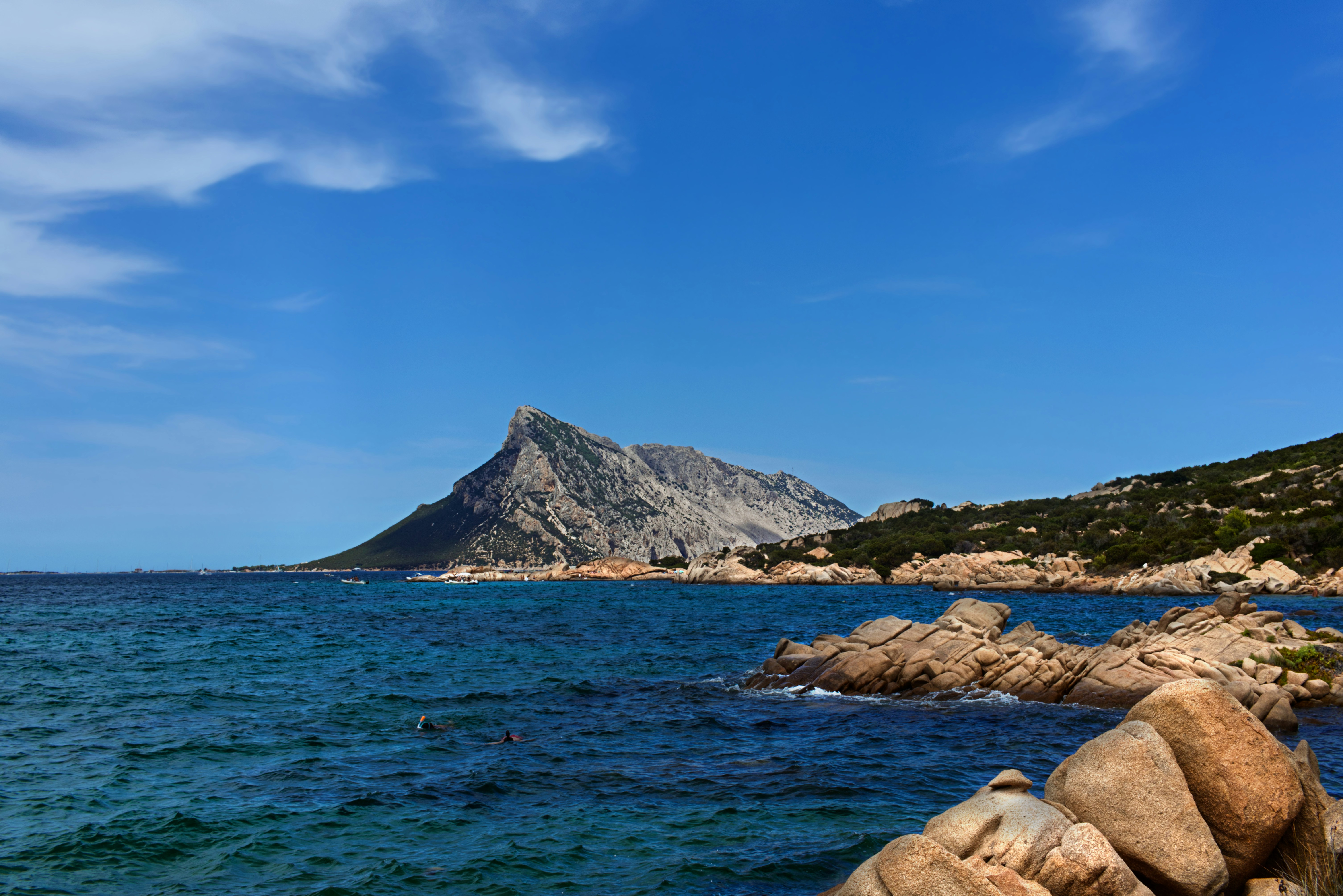 Coastal Peak Rising Above Turquoise Cadence