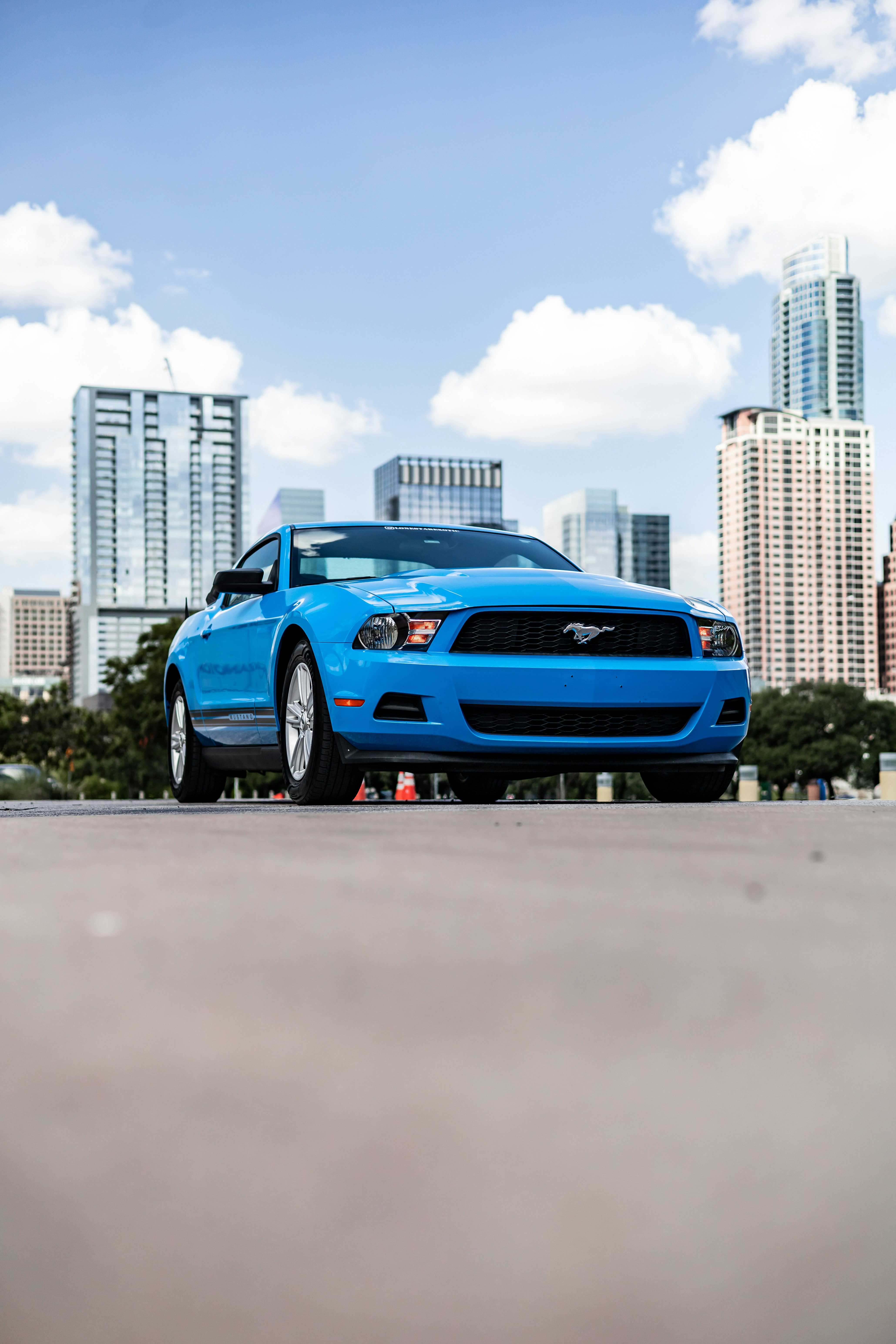 Azure Mustang Stands Bold Under a Glass Skyline