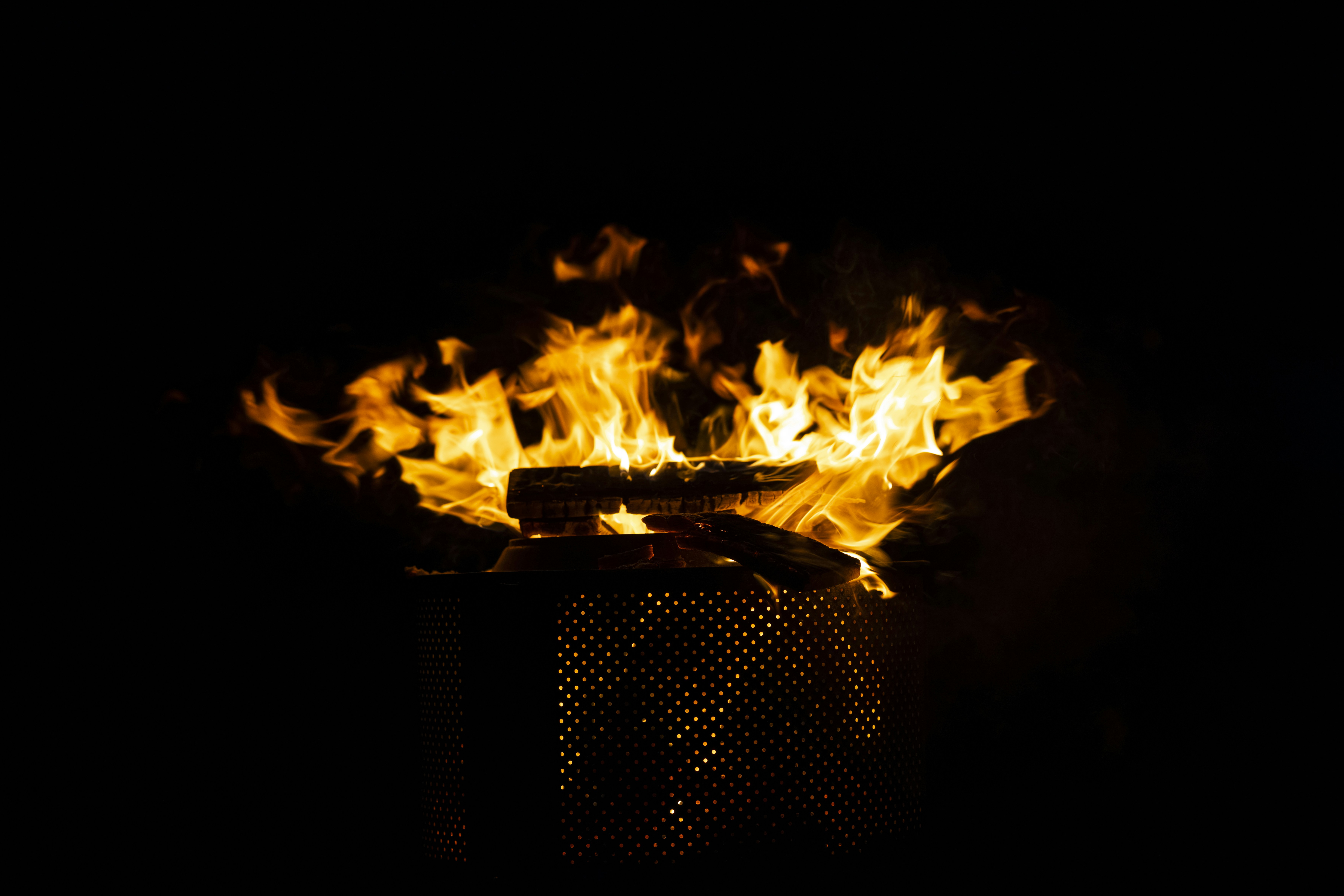 Ember Crown on a Perforated Drum Beneath Night