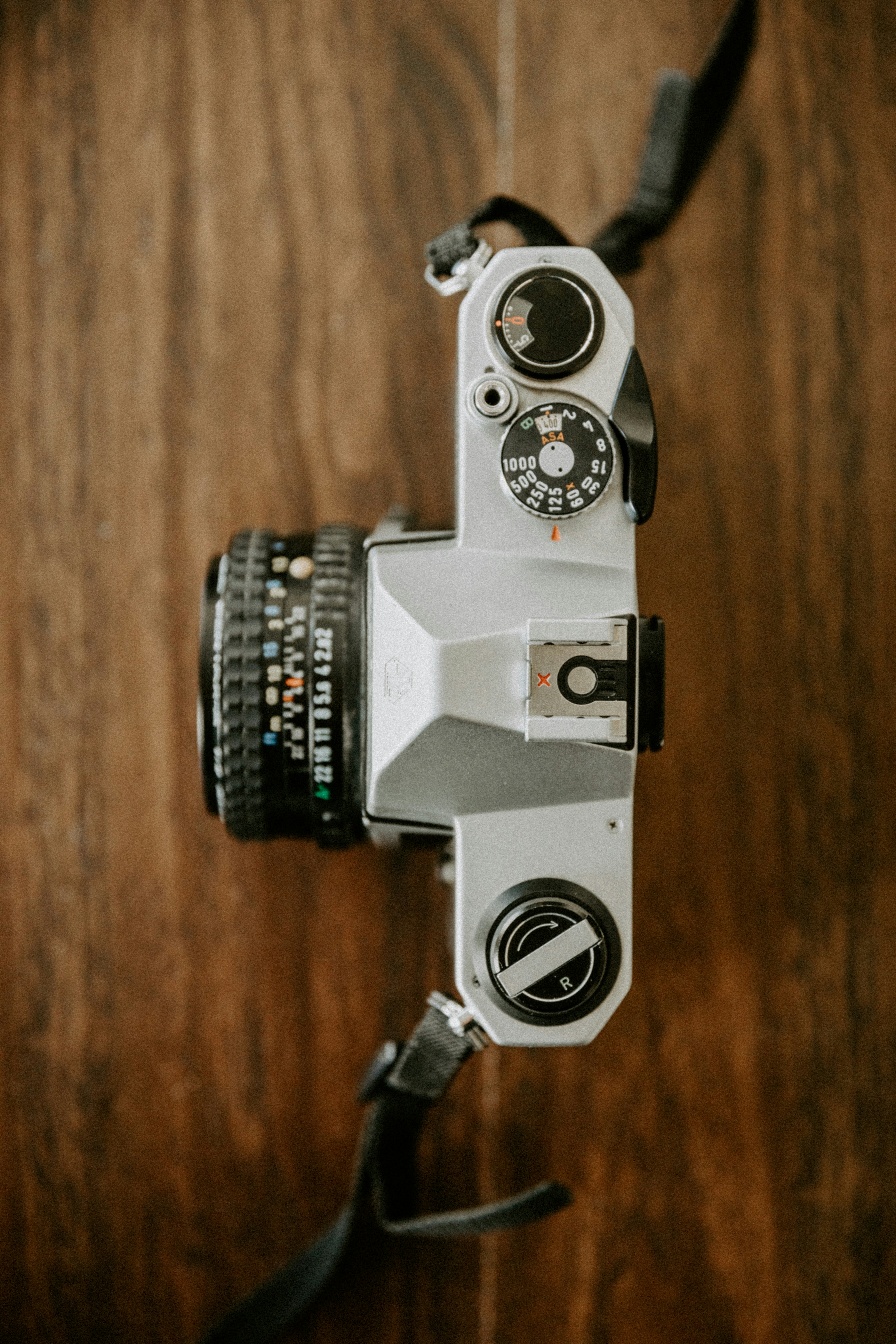 Black and gray camera on brown wooden table photo – Free Camera Image ...
