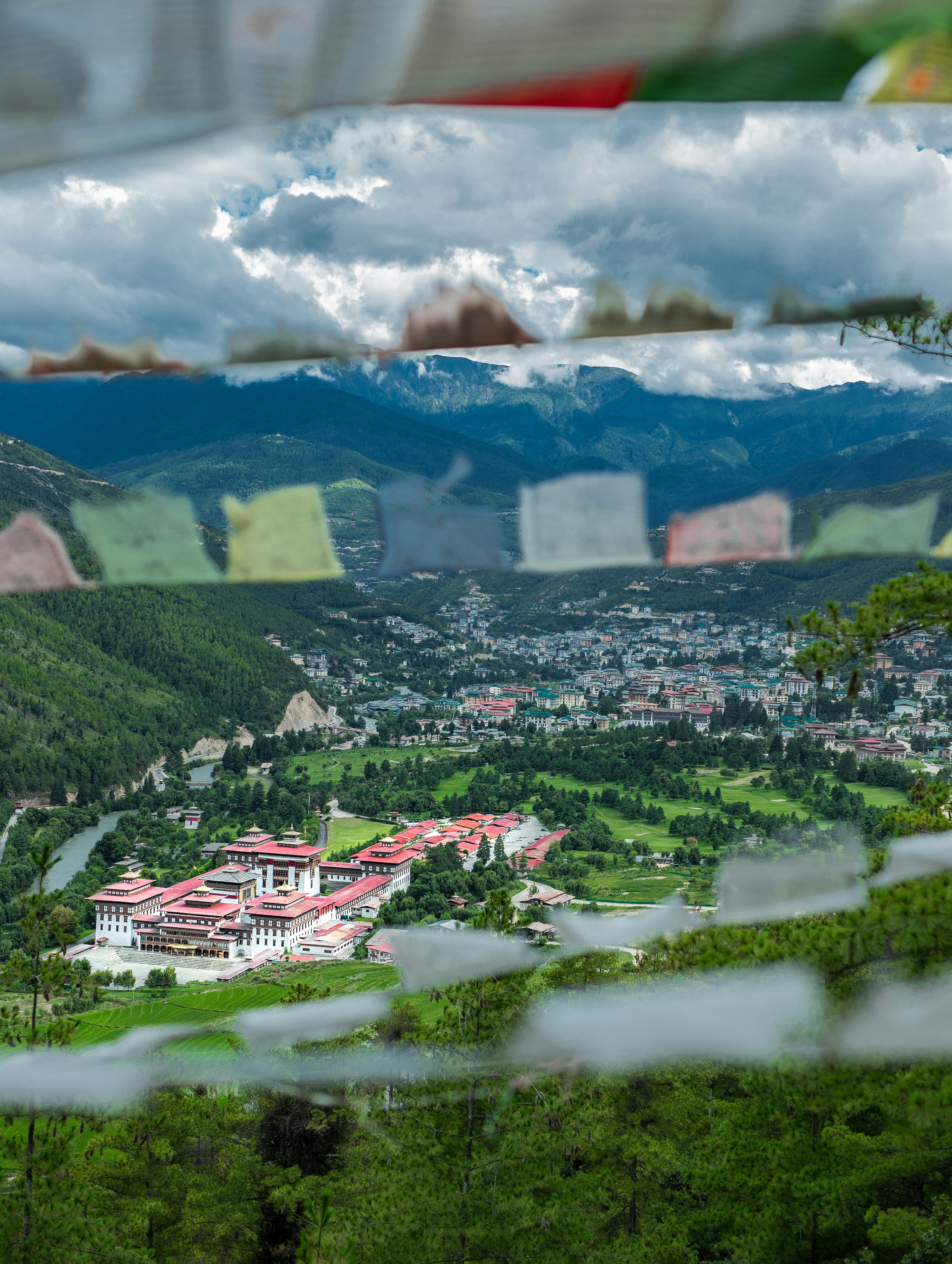 Houses on green grass field near mountain under white clouds during daytime photo – Free Thimphu ...