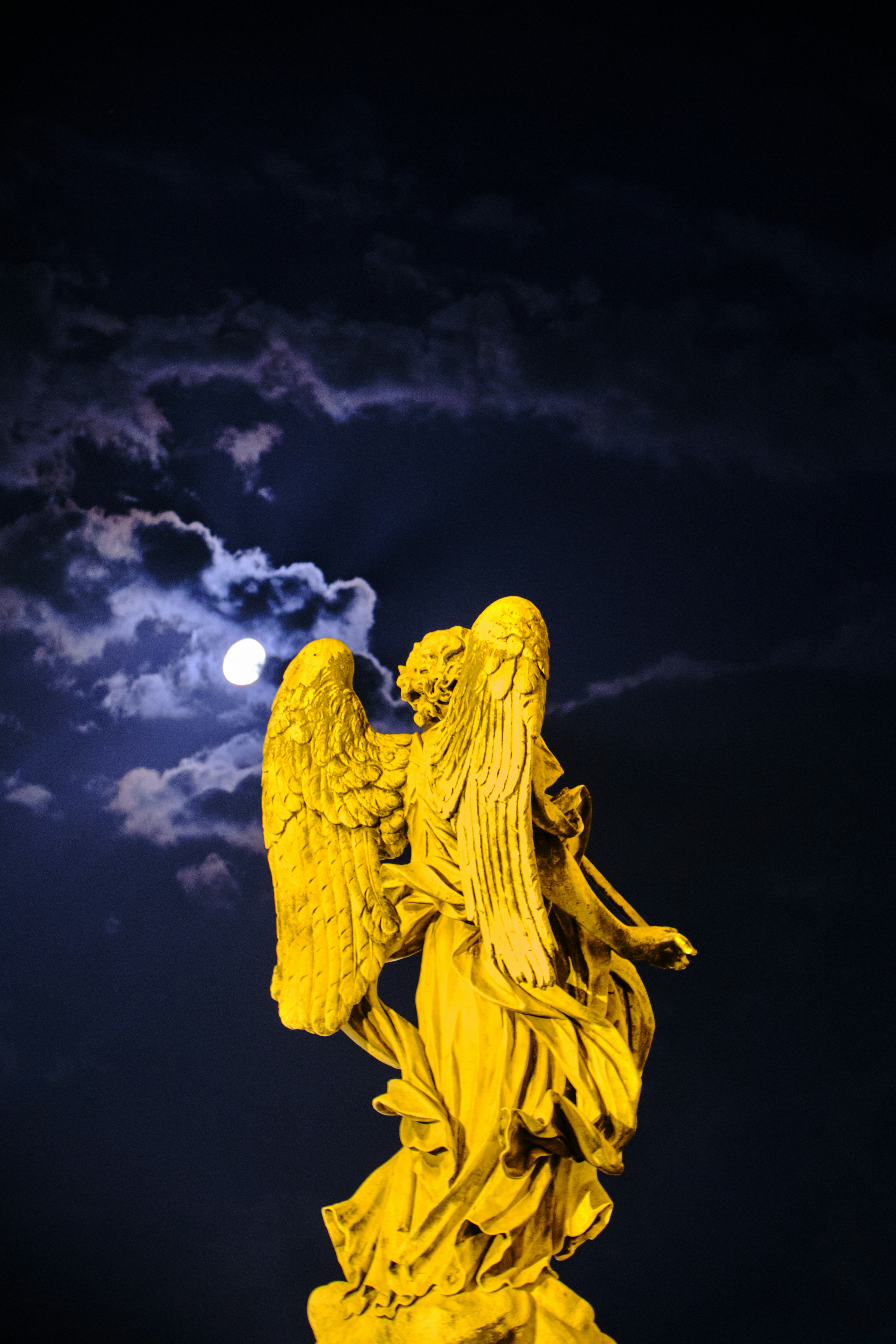 Moonlit Guardian: a gold-illuminated angel against a velvet night