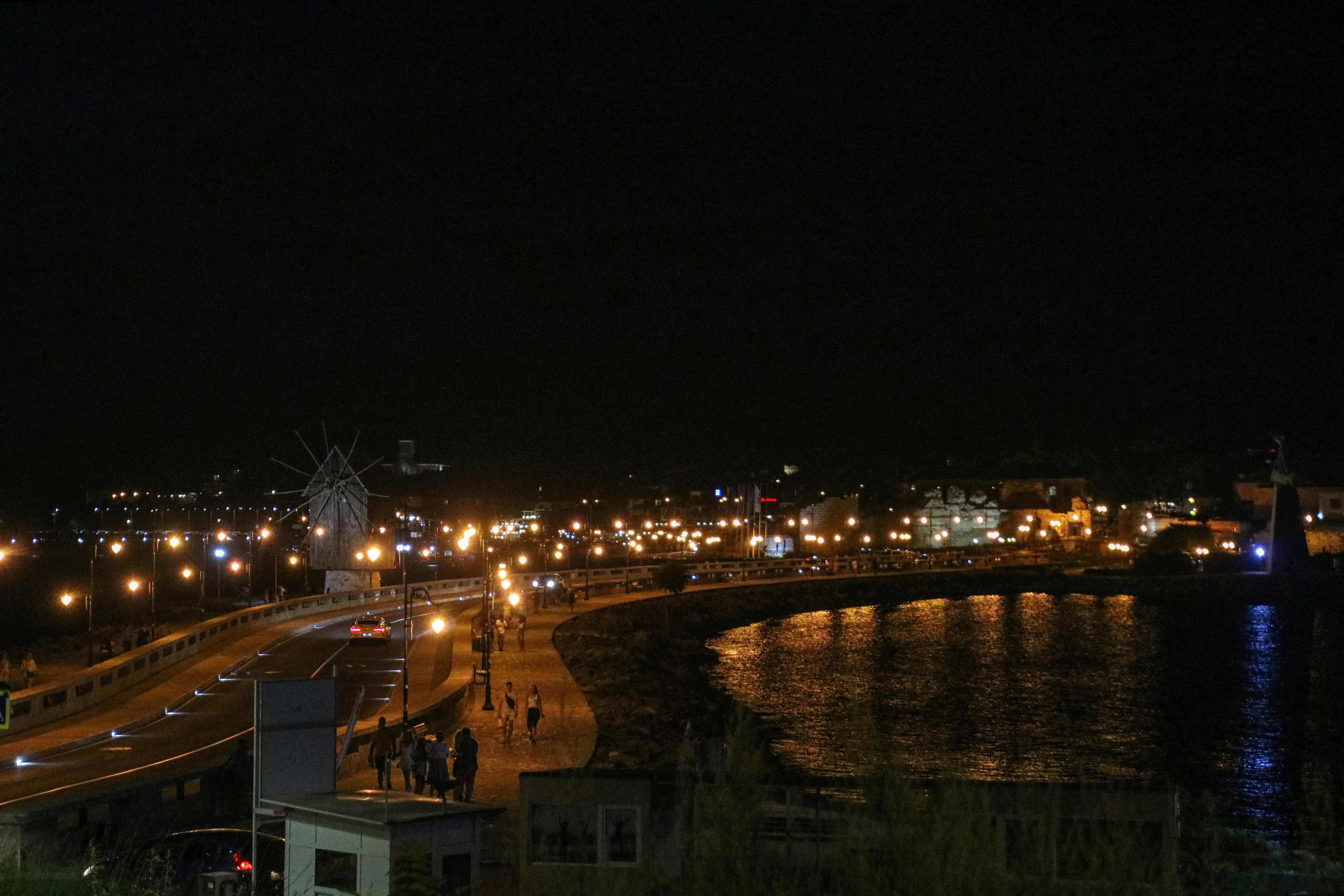 Ferris Wheel at Night: Lantern-lit Promenade Over a Quiet Harbor