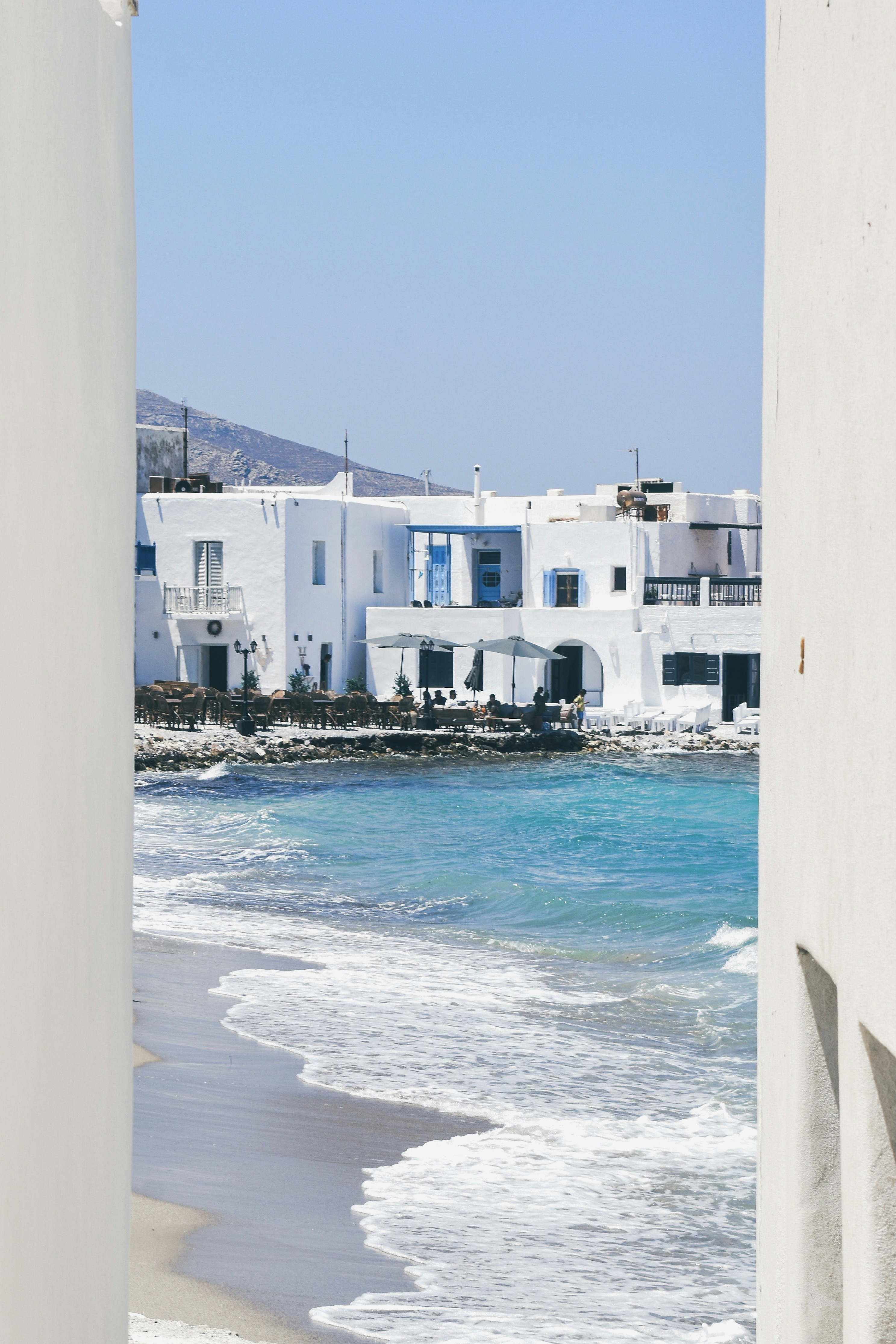 White concrete building near sea during daytime photo – Free Blue Image ...