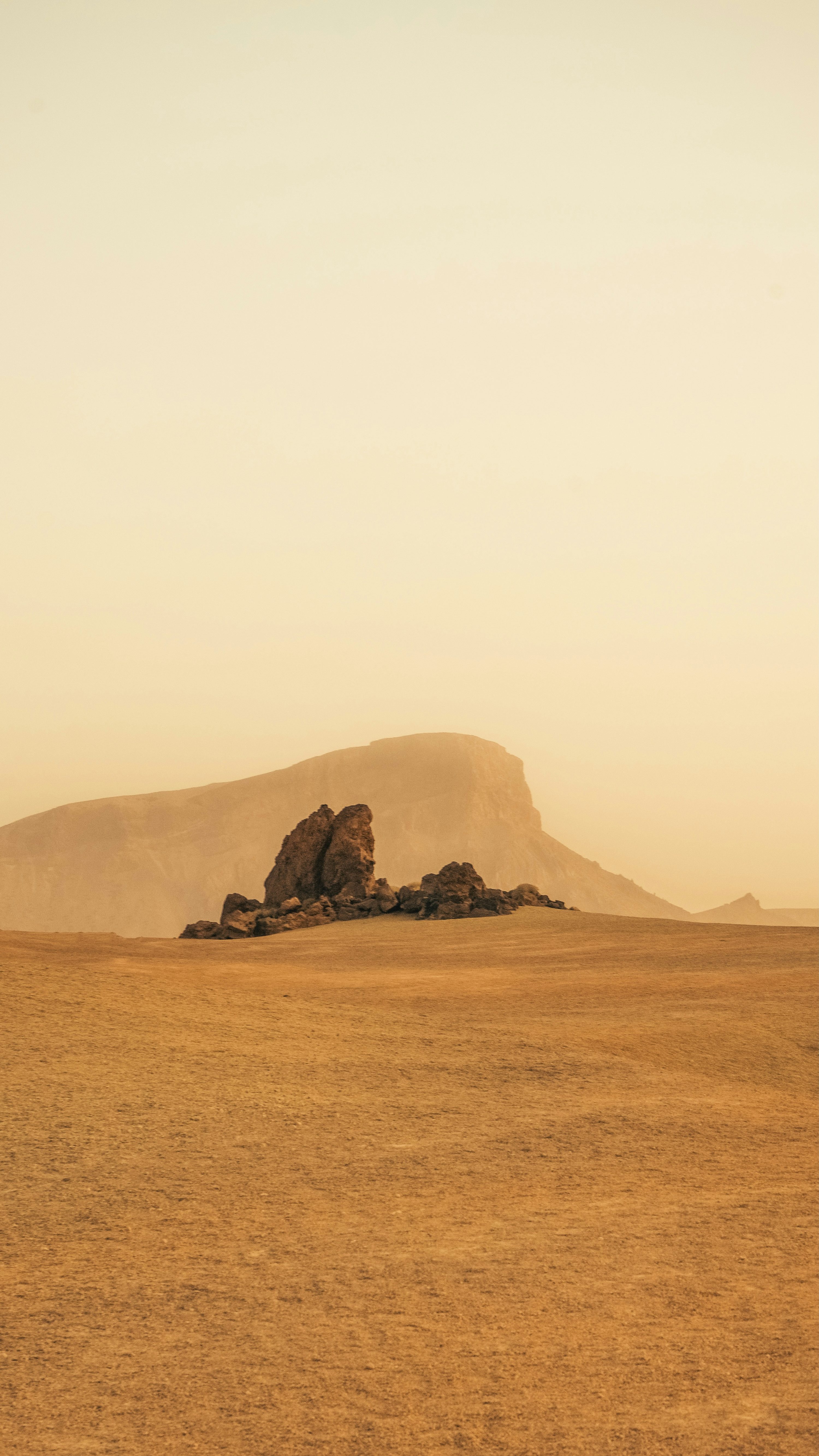 Brown rock formation on brown sand during daytime photo – Free ... Brown rock formation on brown sand during daytime photo – Free ...