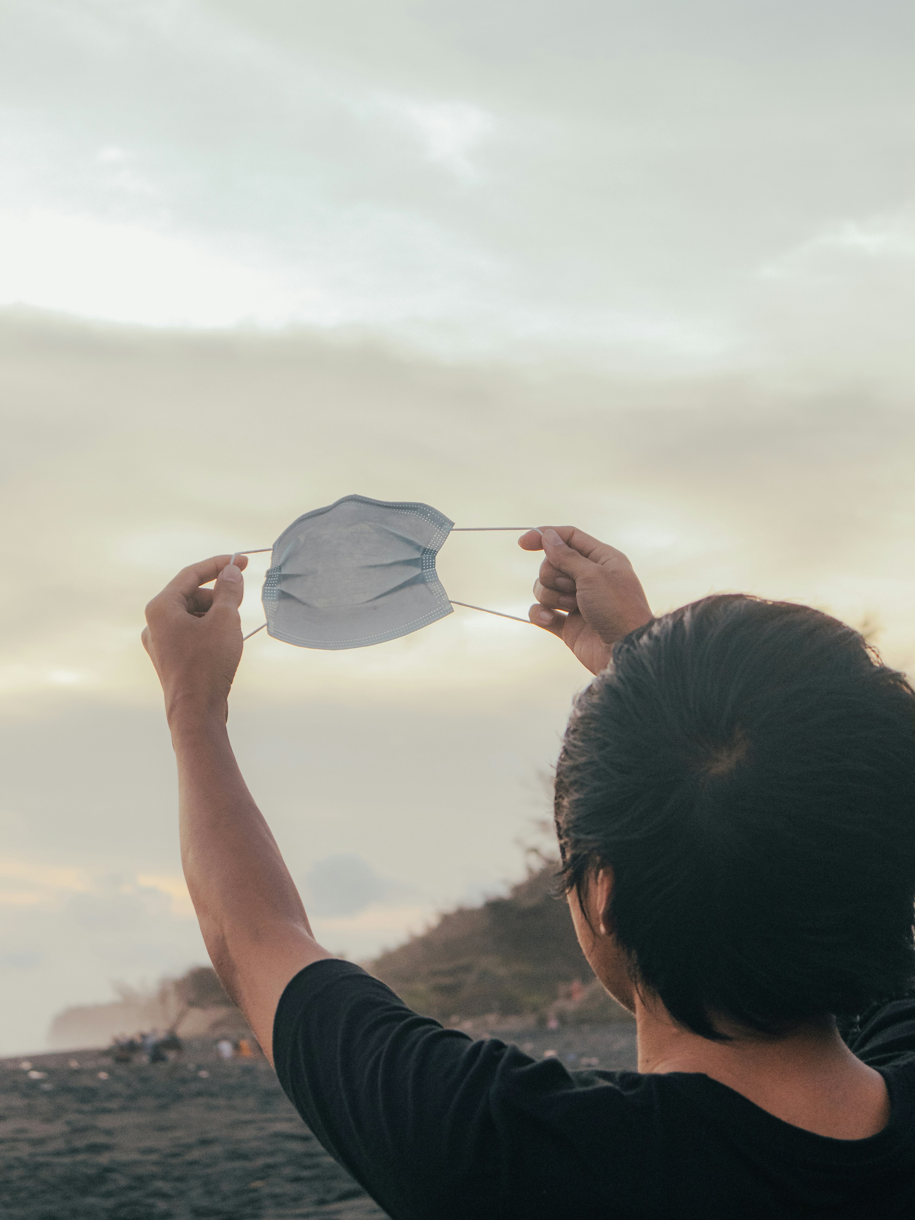 Dusk Lift: The Mask Raised Over a Quiet Seashore
