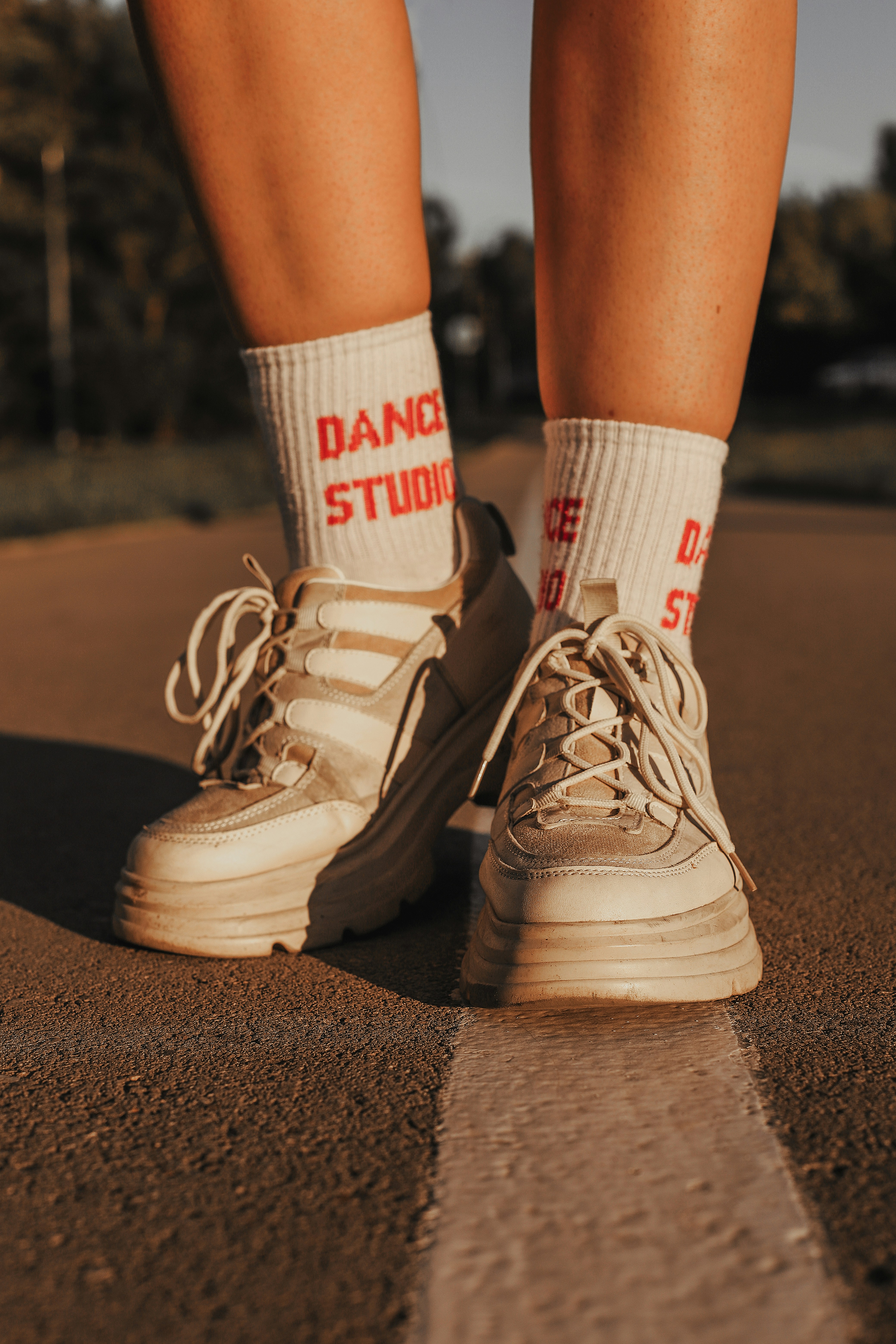 Grounded Steps: Sneakers on a Sunlit Track