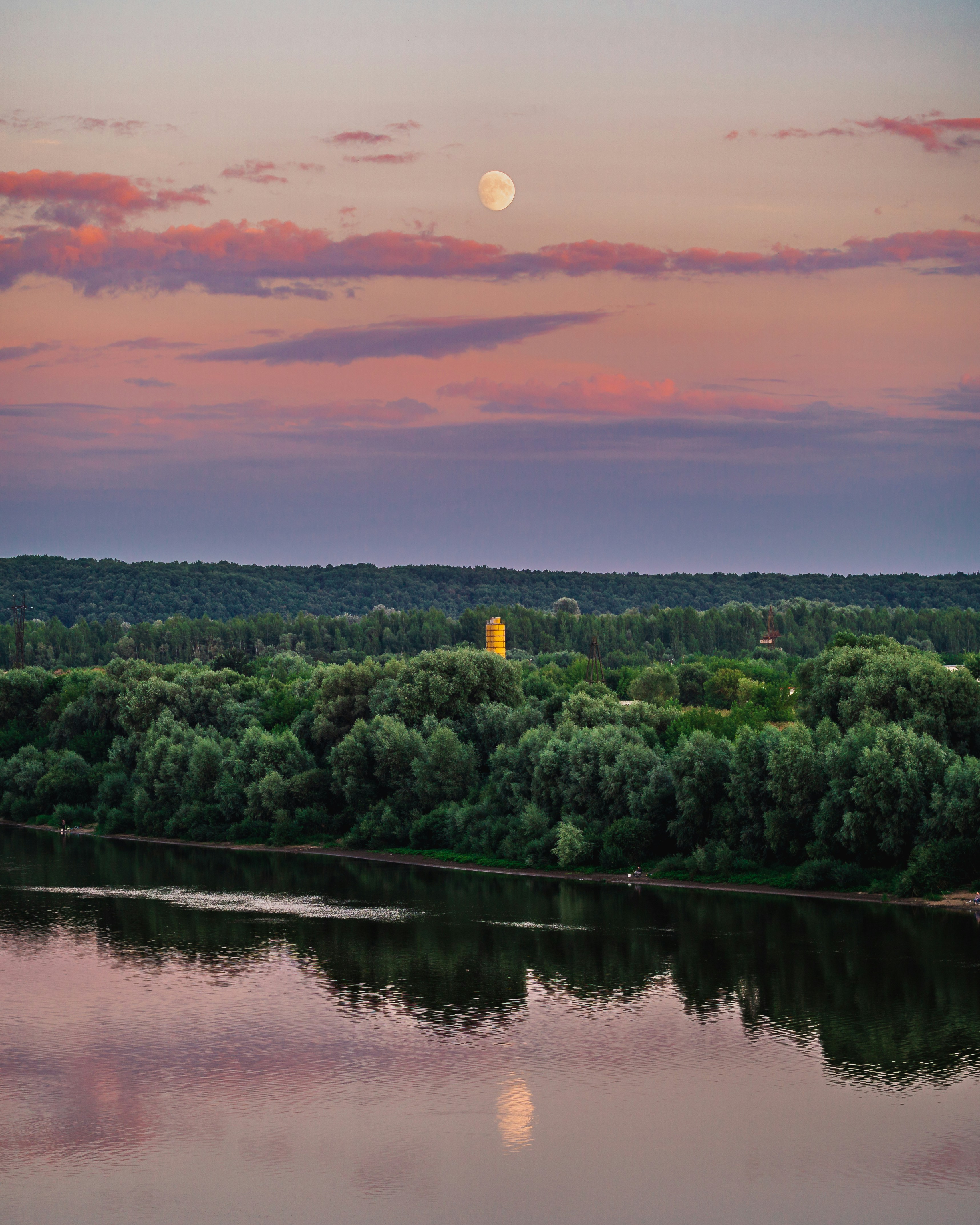 Yellow Beacon on the Riverbank at Sunset