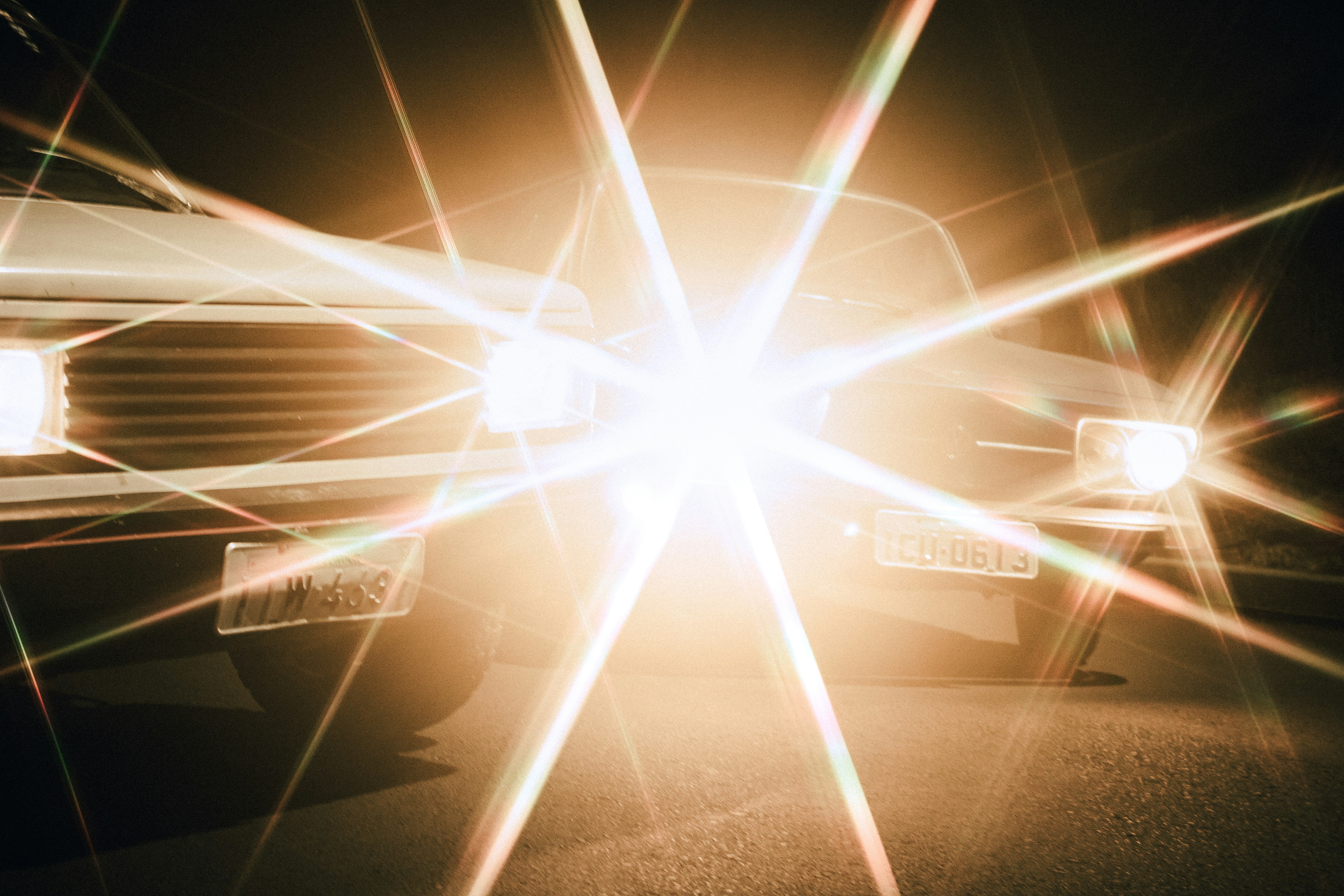 Convergence of Chrome and Light: Twin Headlights in a Starburst Moment