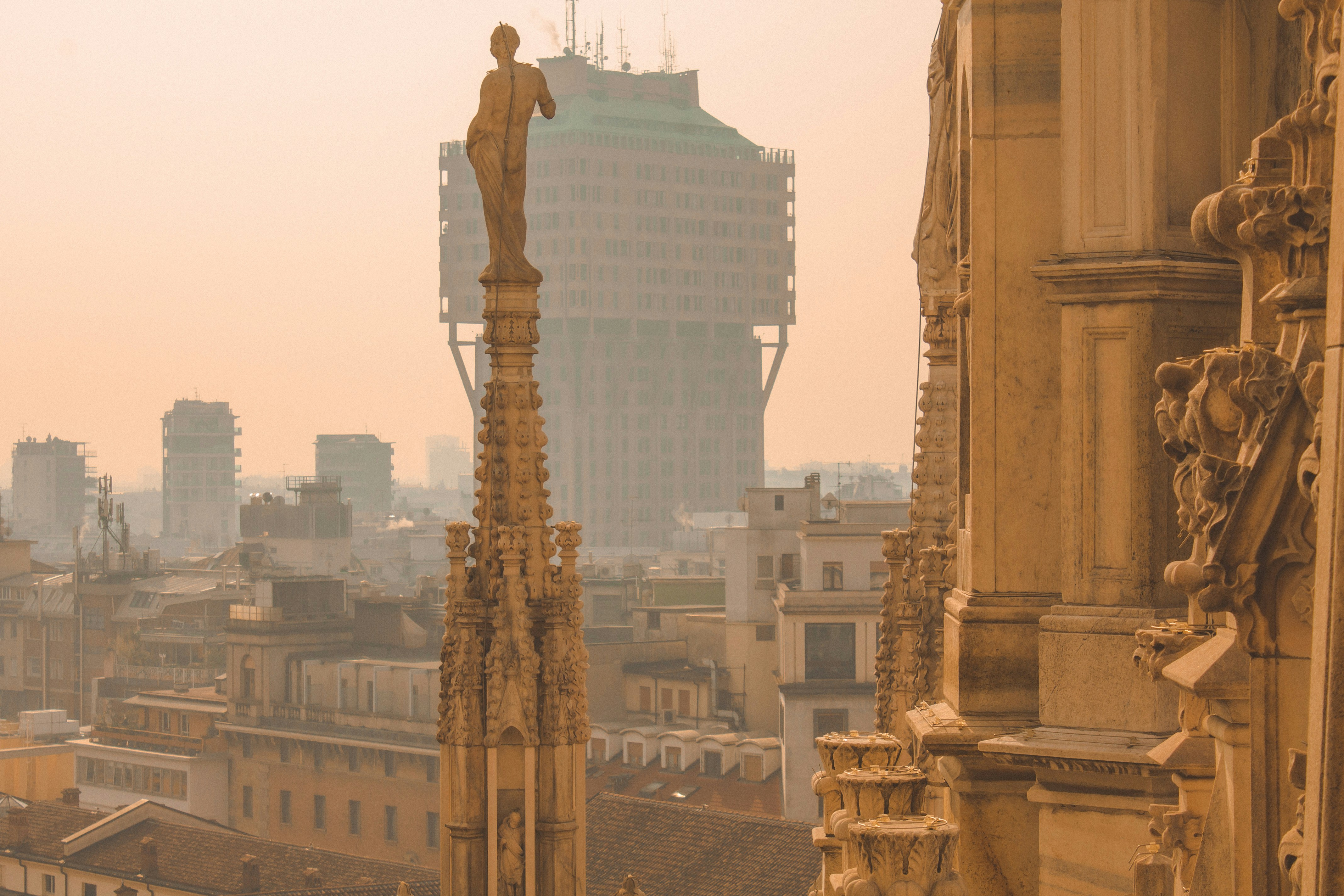 Leading Gilded Spires: City Skyline Framed by Ornate Roofline
