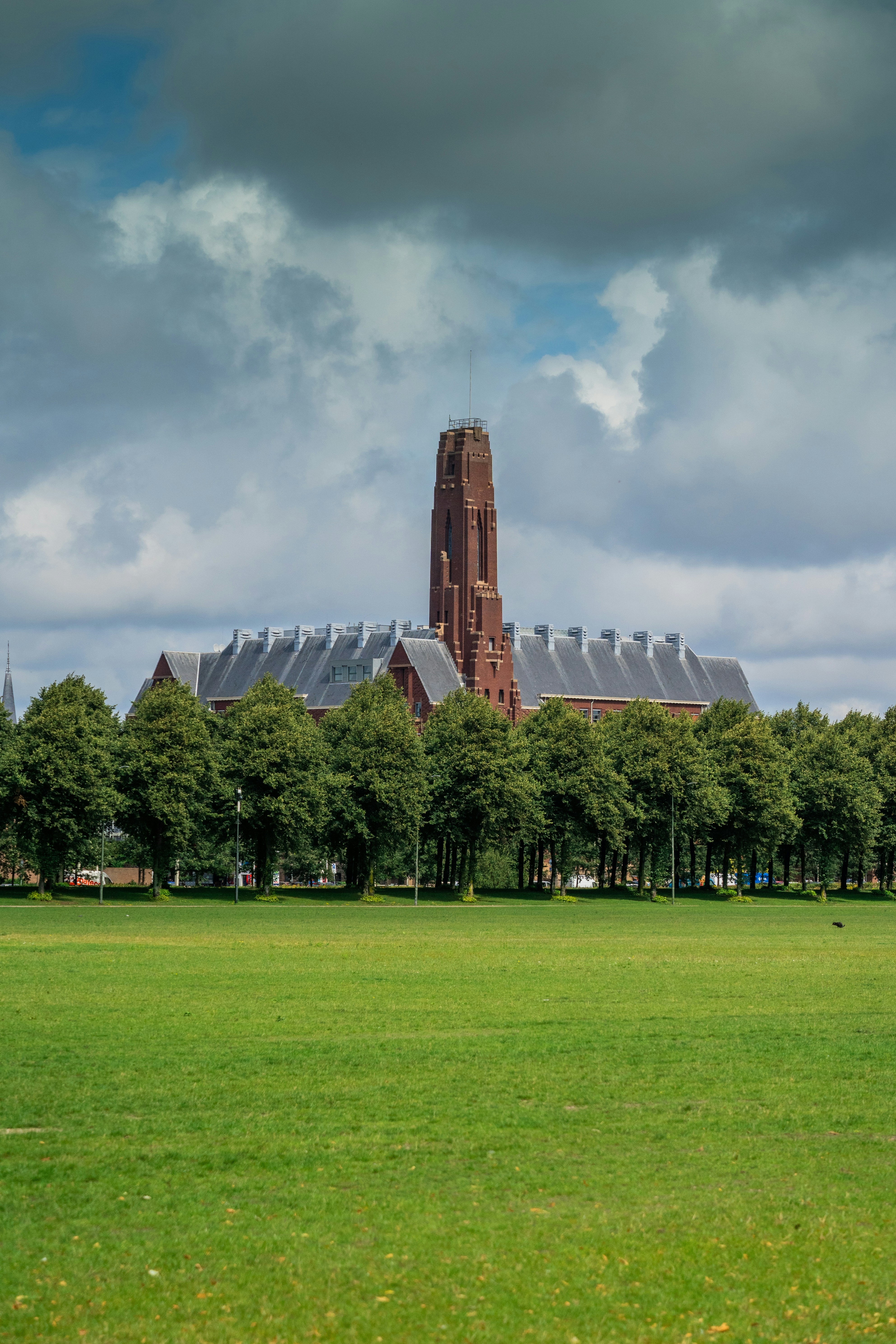 Brick Tower Rising Above a Tree-Line Campus