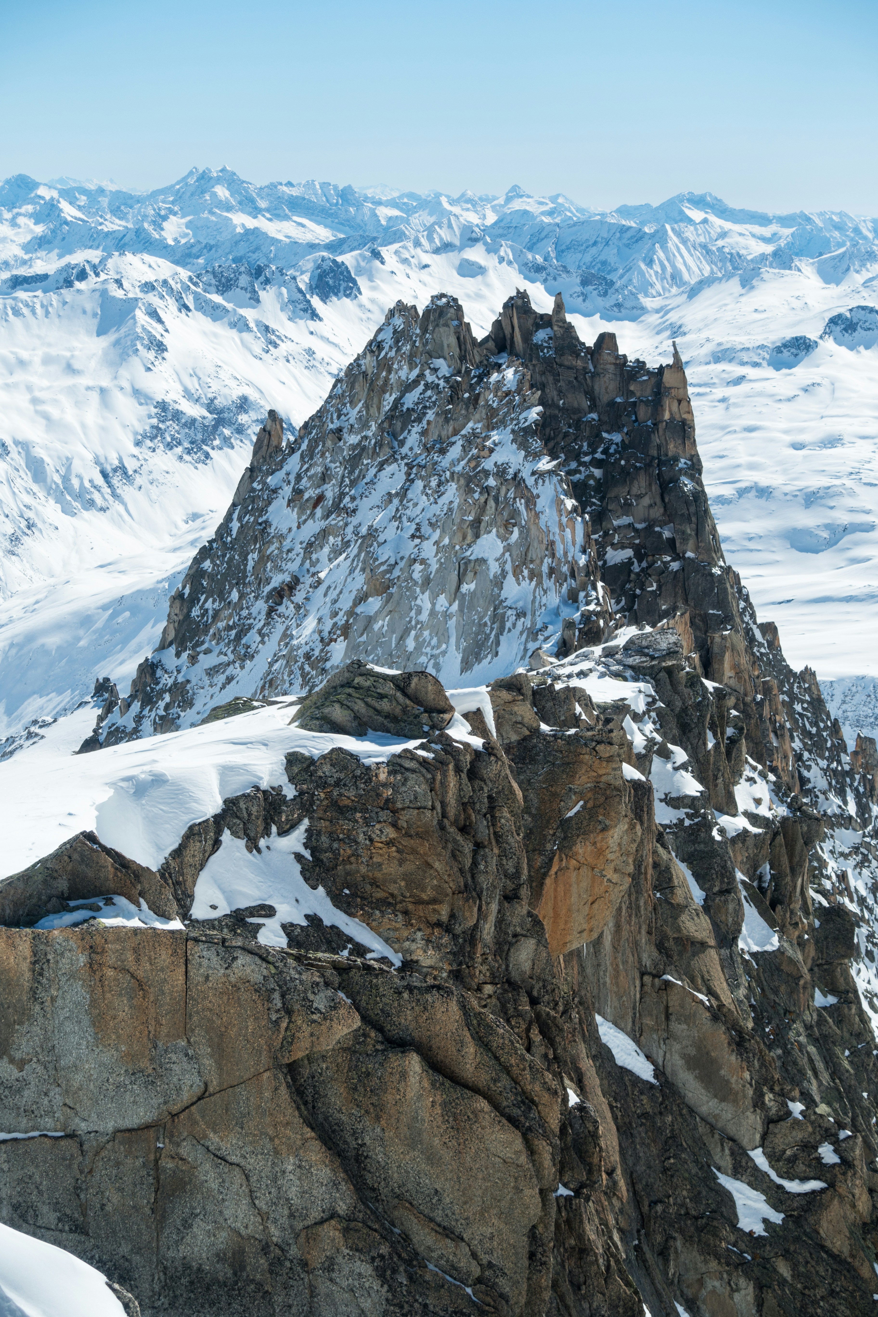 Gray rocky mountain covered with snow during daytime photo – Free ...