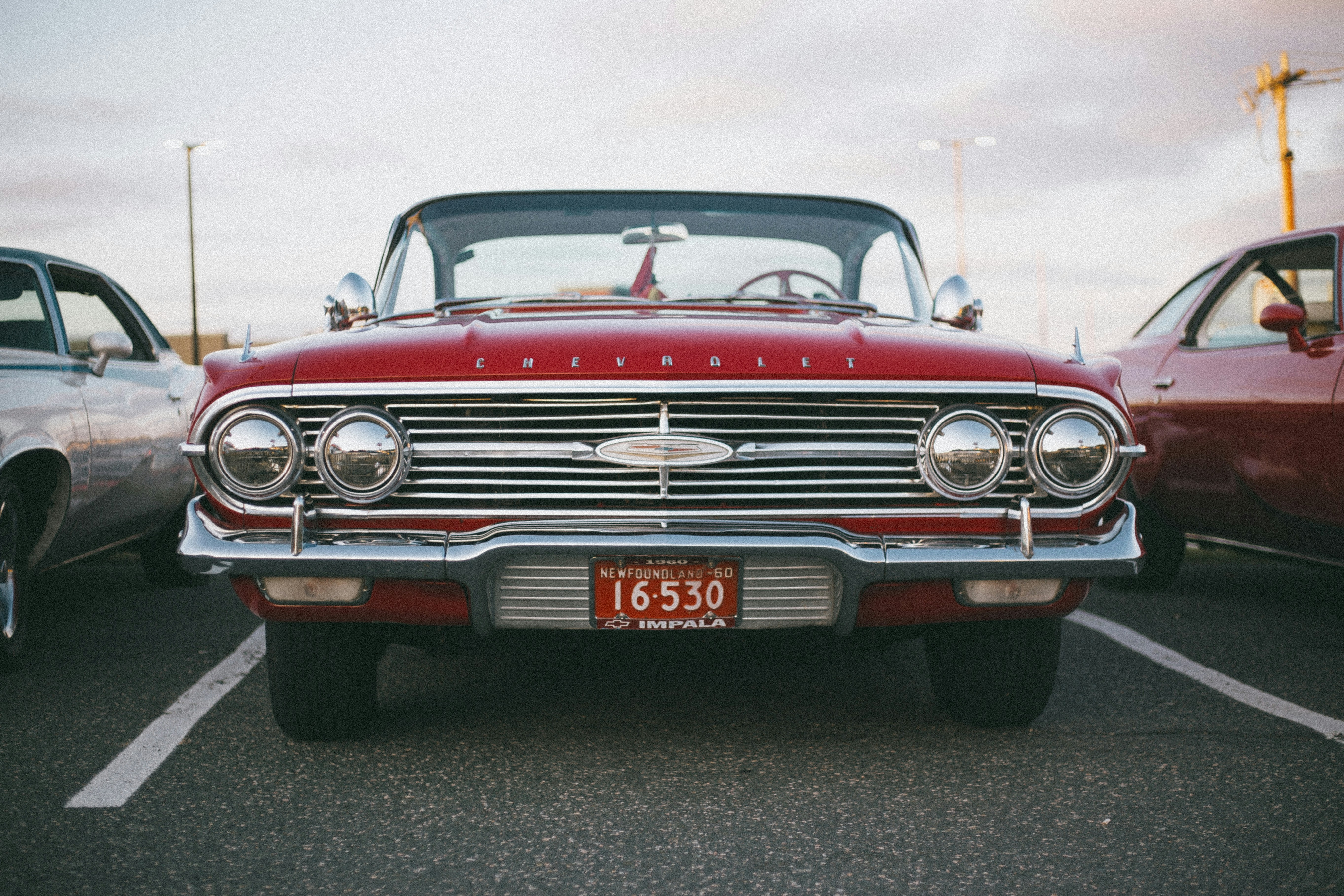 Red and white chevrolet car photo – Free Brown Image on Unsplash