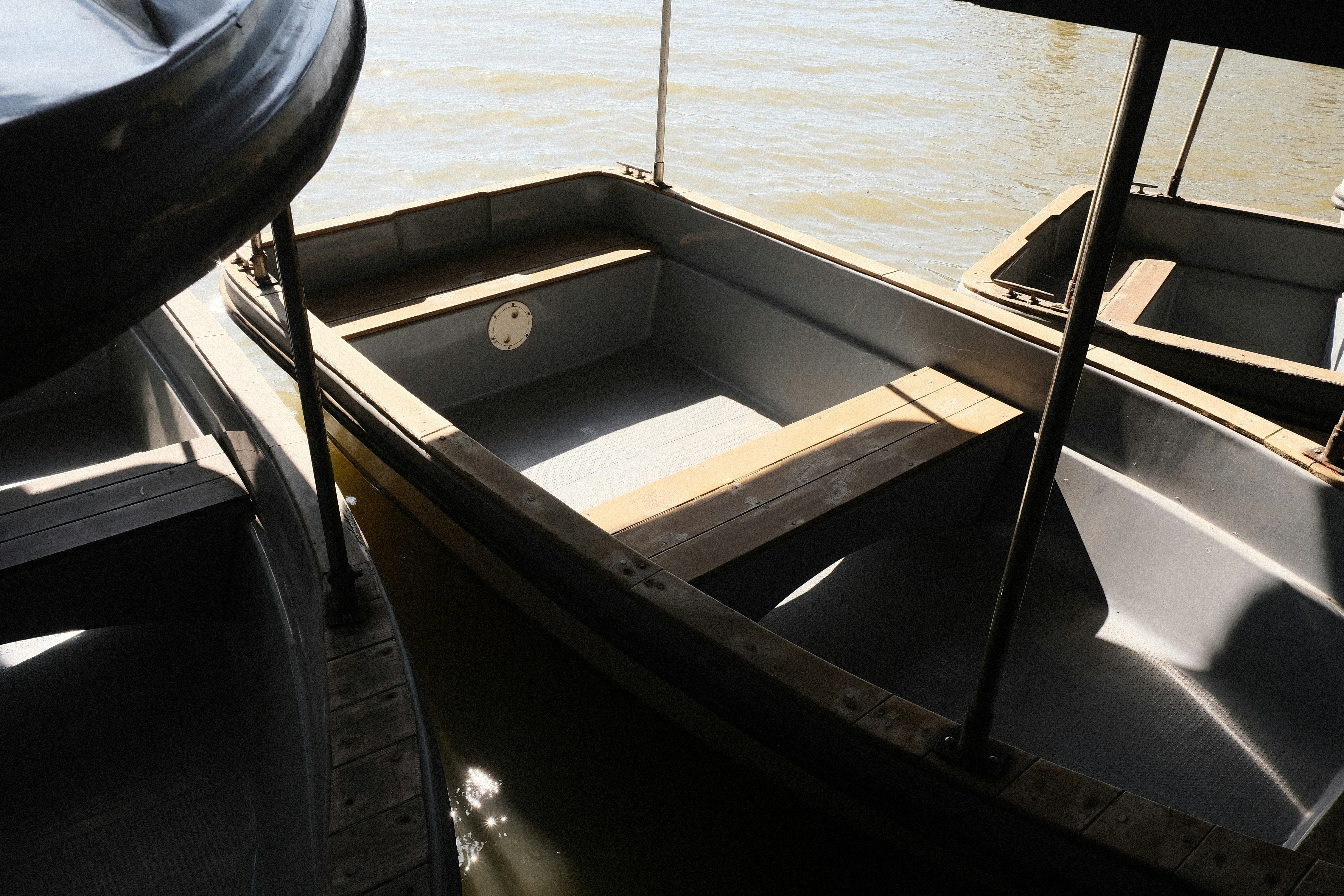 black and brown boat on body of water during daytime