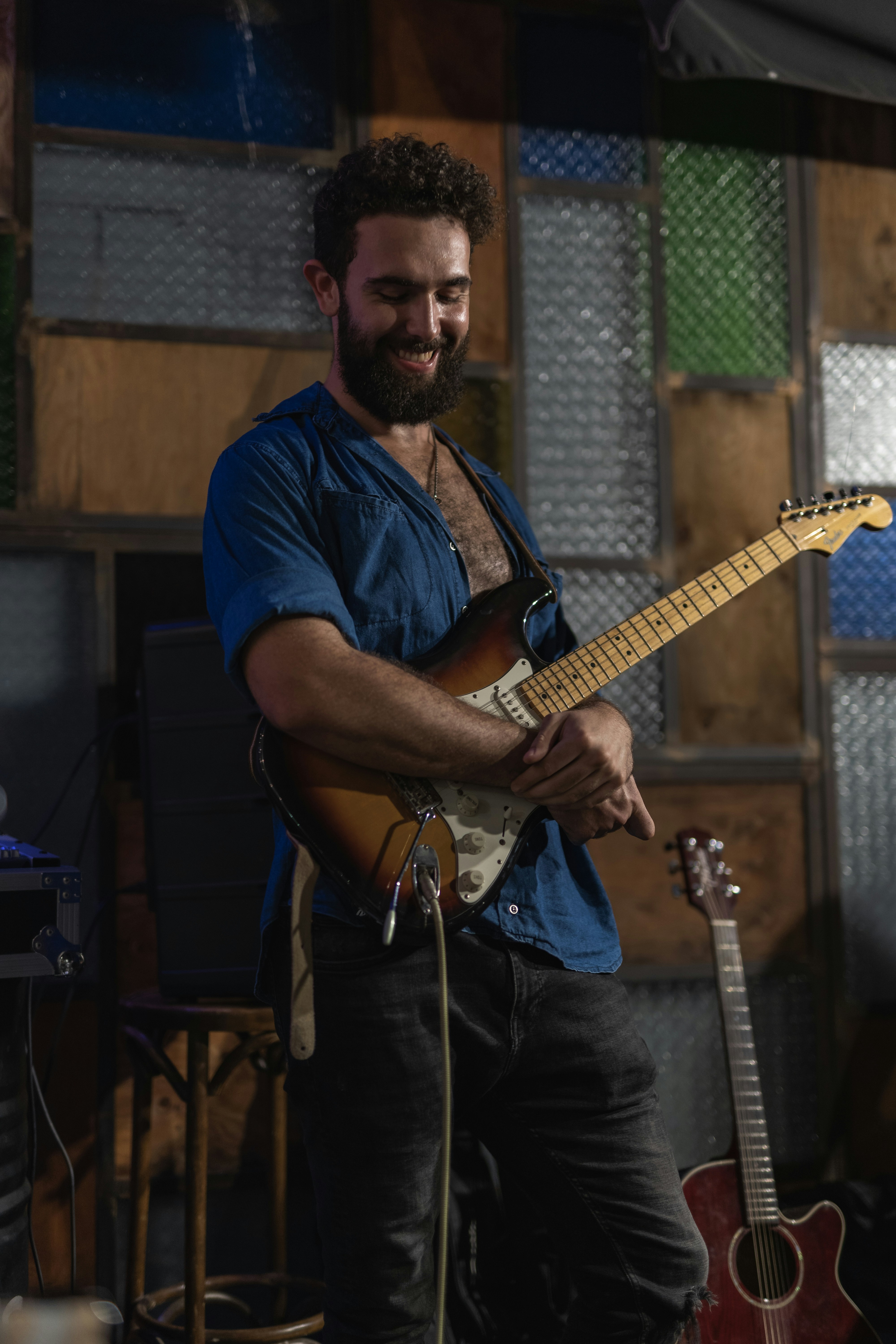Sunburst Strat Serenade in a Dim Studio