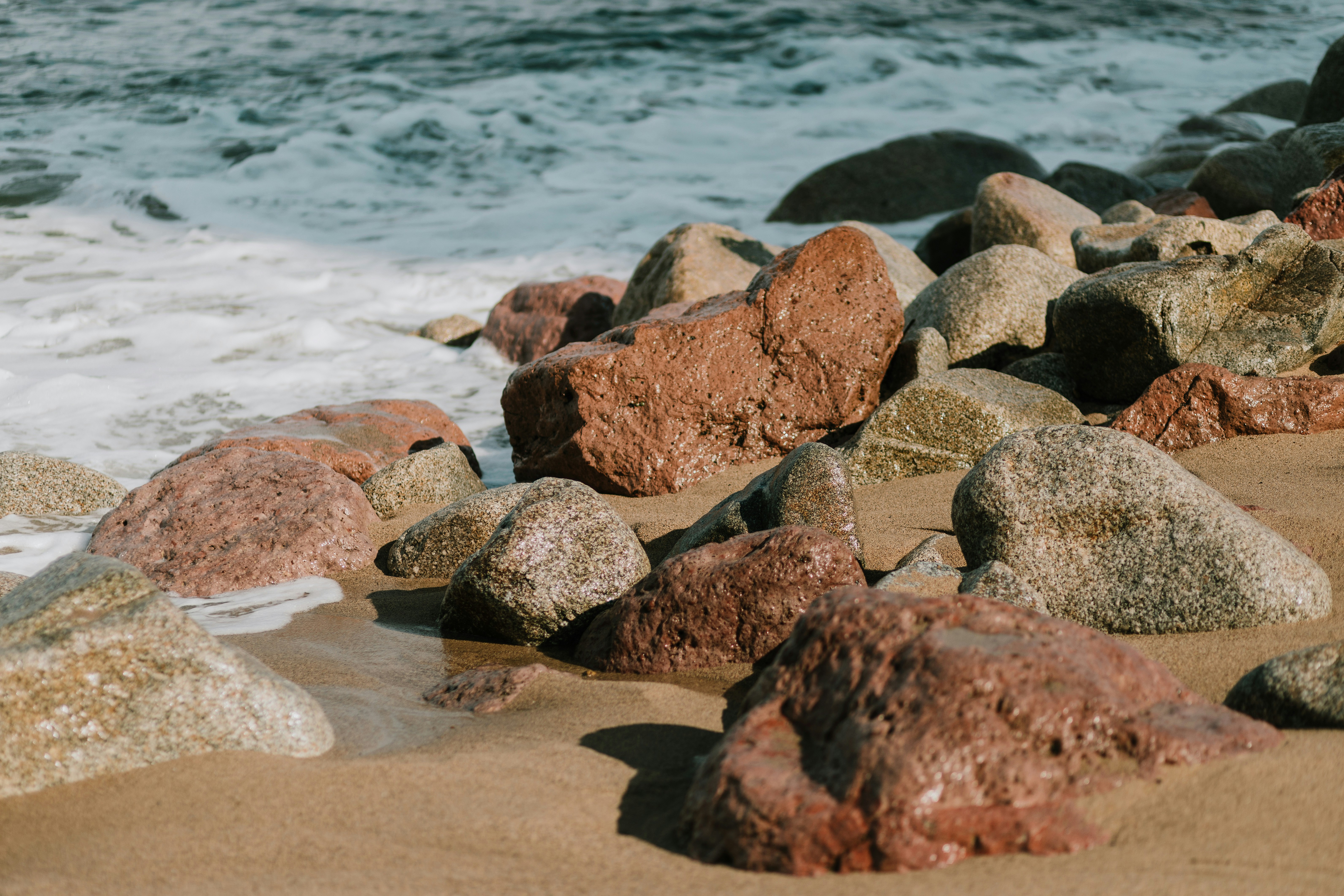 Brown and gray rocks on seashore during daytime photo – Free Puerto ...