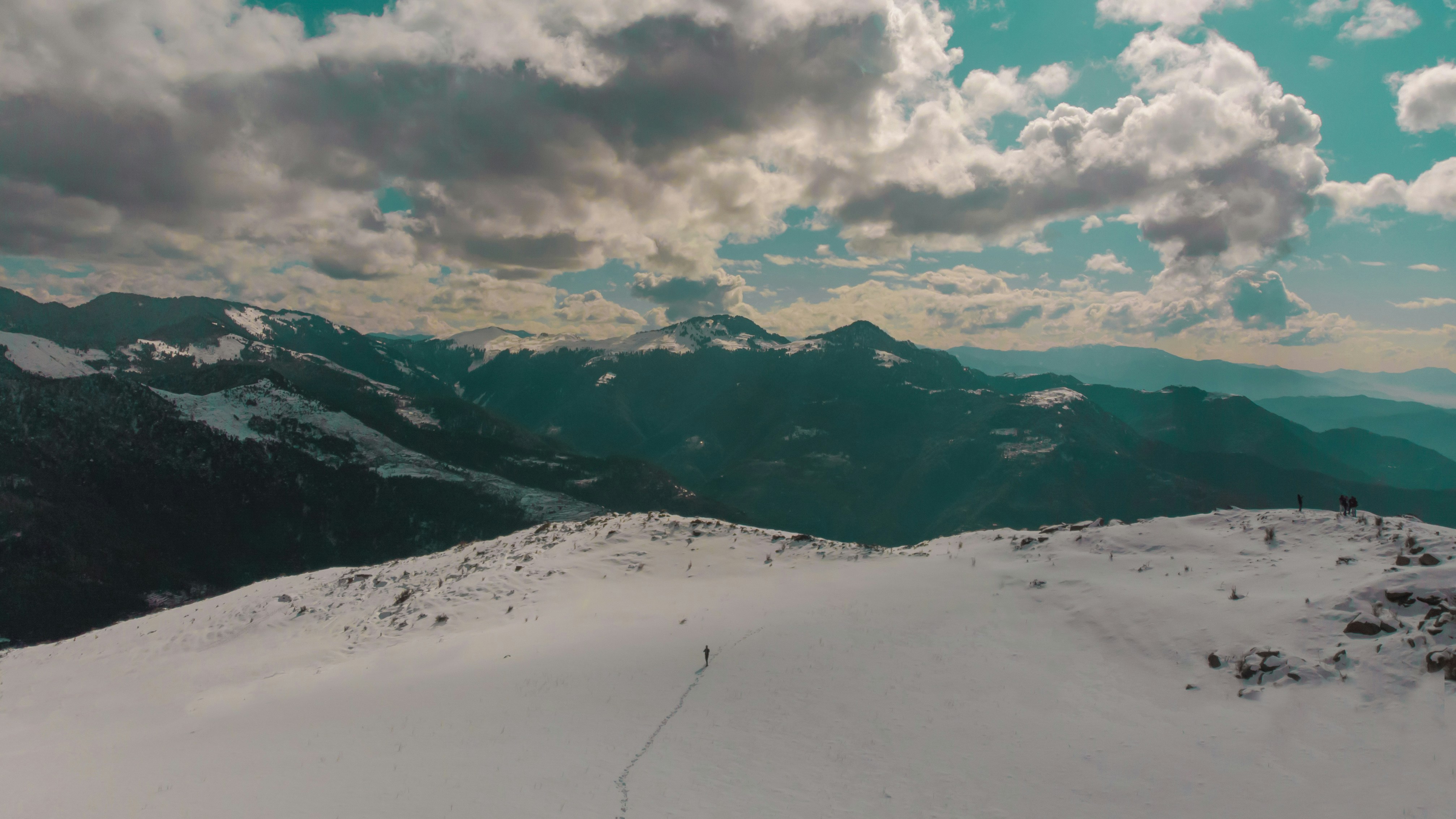 snow covered mountain under cloudy sky during daytime