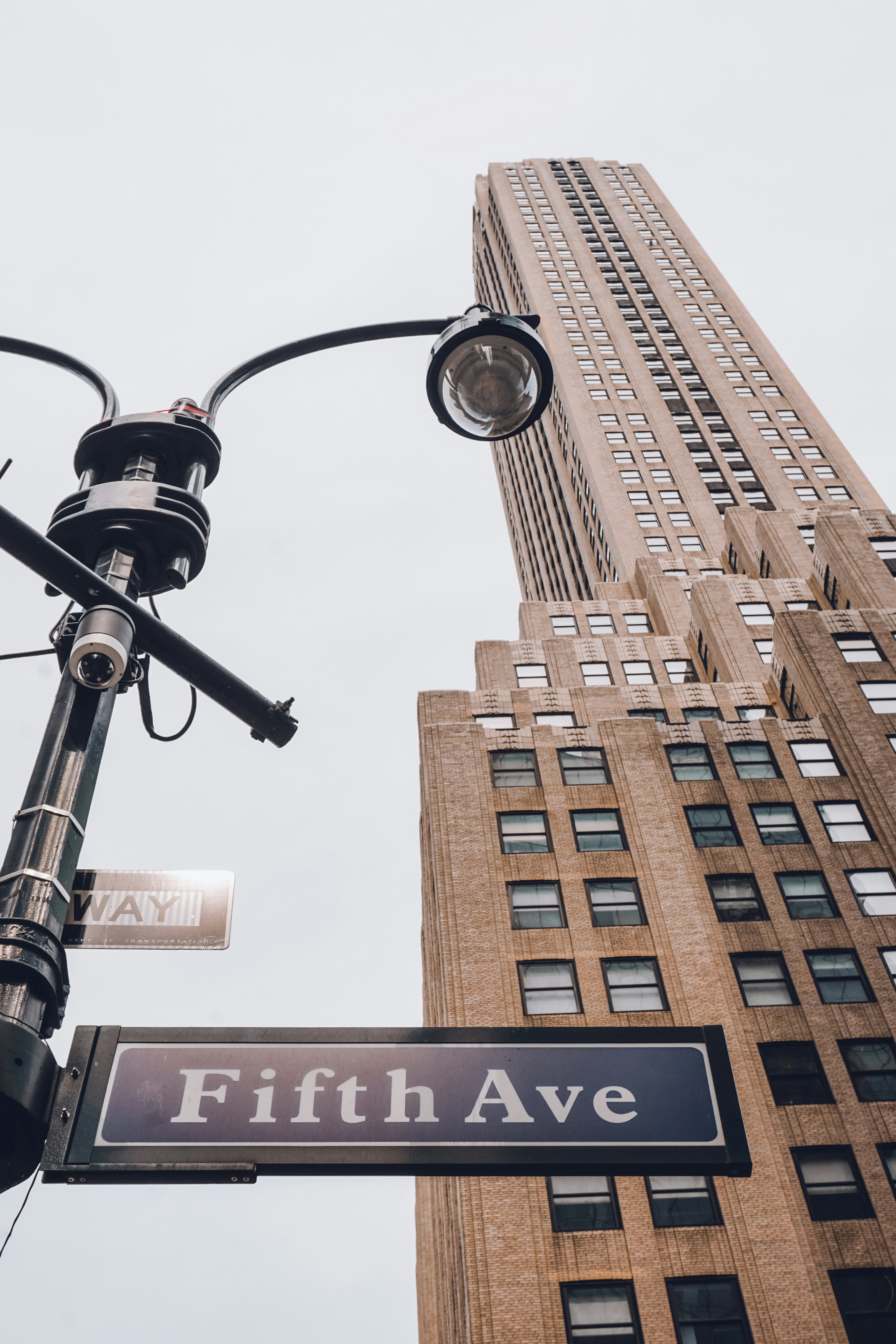 Low-Angle Fifth Ave: Streetlamp Framing an Art Deco Tower
