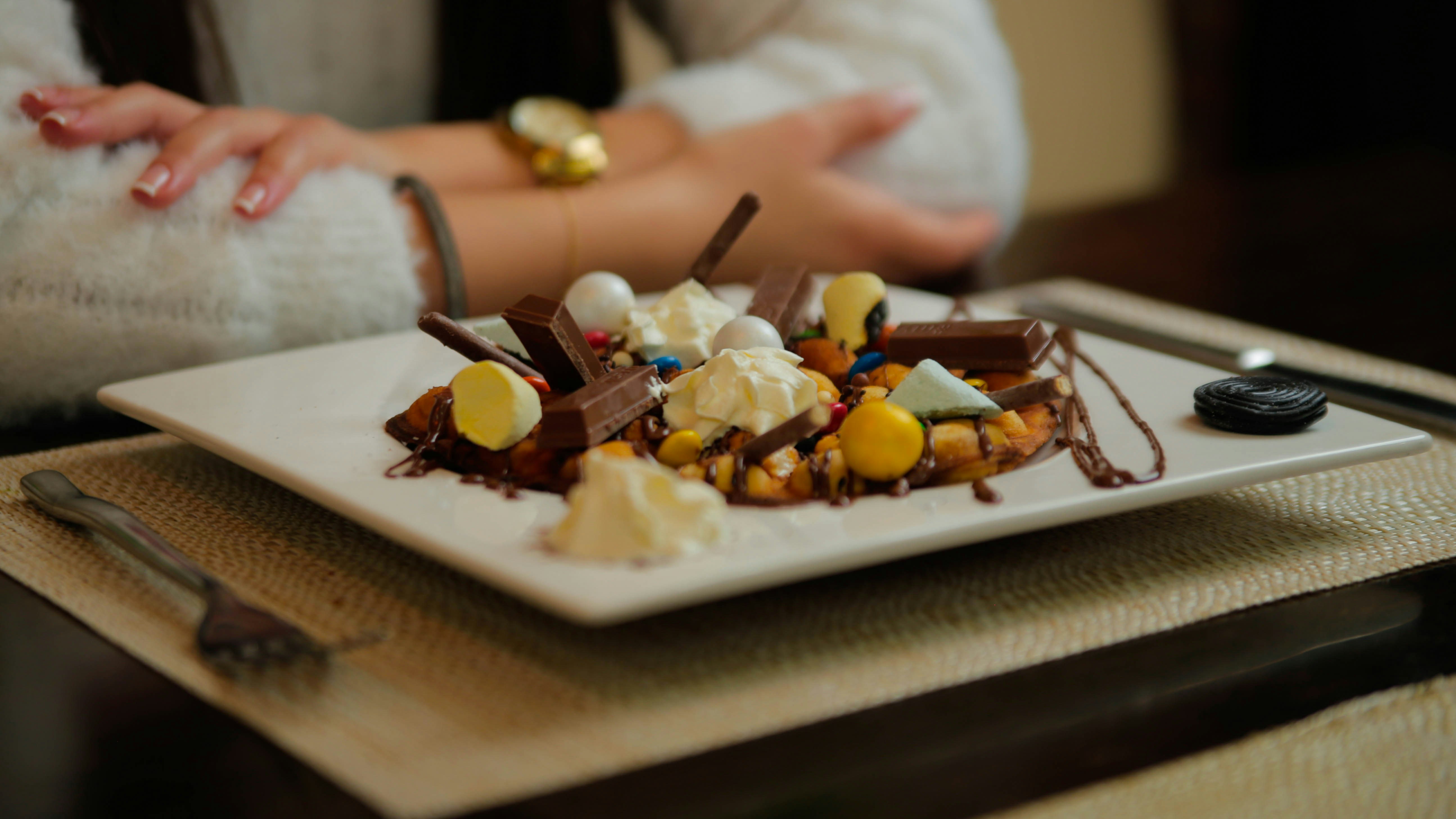 Chocolate Mosaic with Cream Peaks on a Cozy Restaurant Plate
