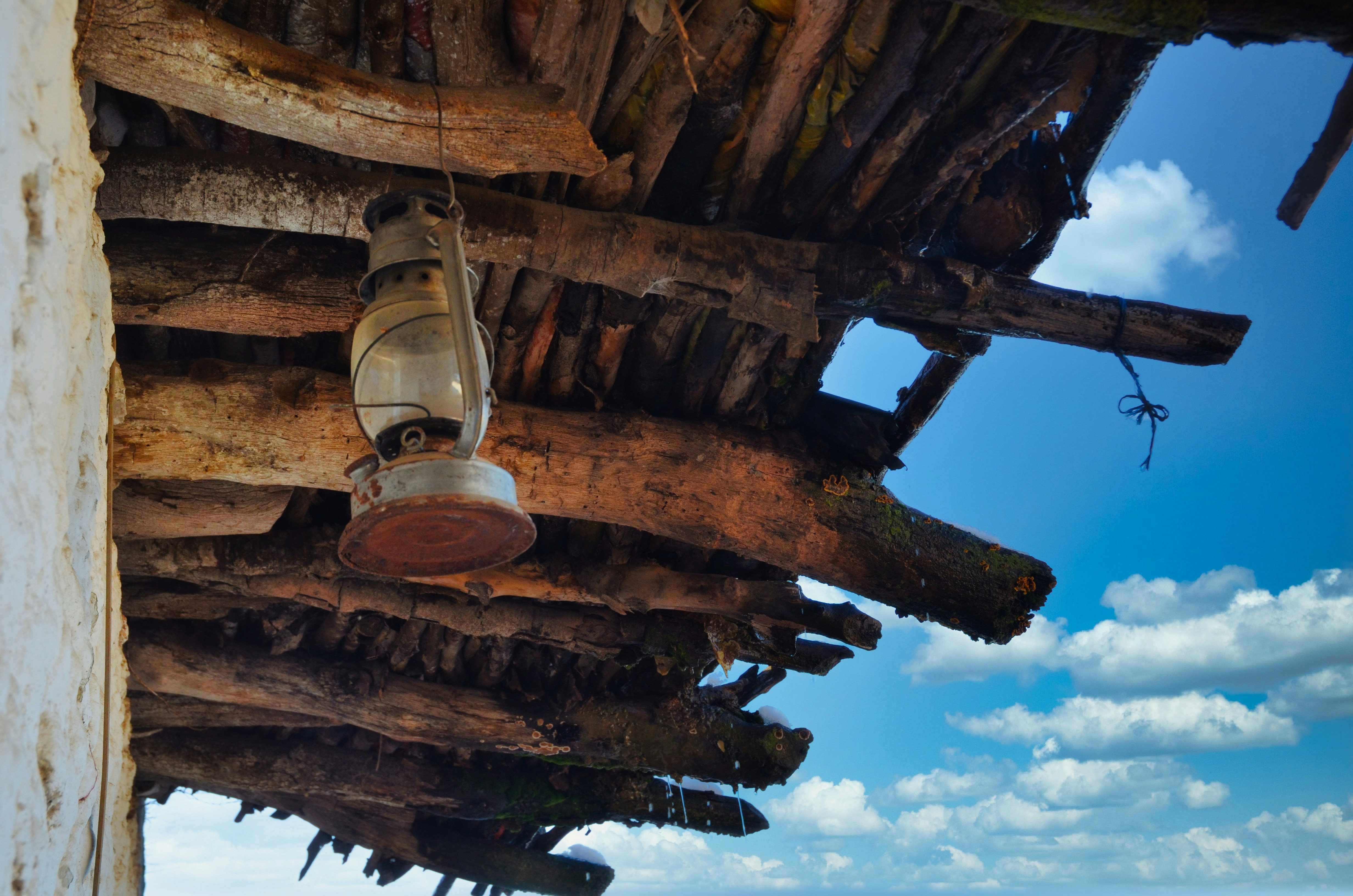 Rustic Overhang with Lantern Under a Clear Sky