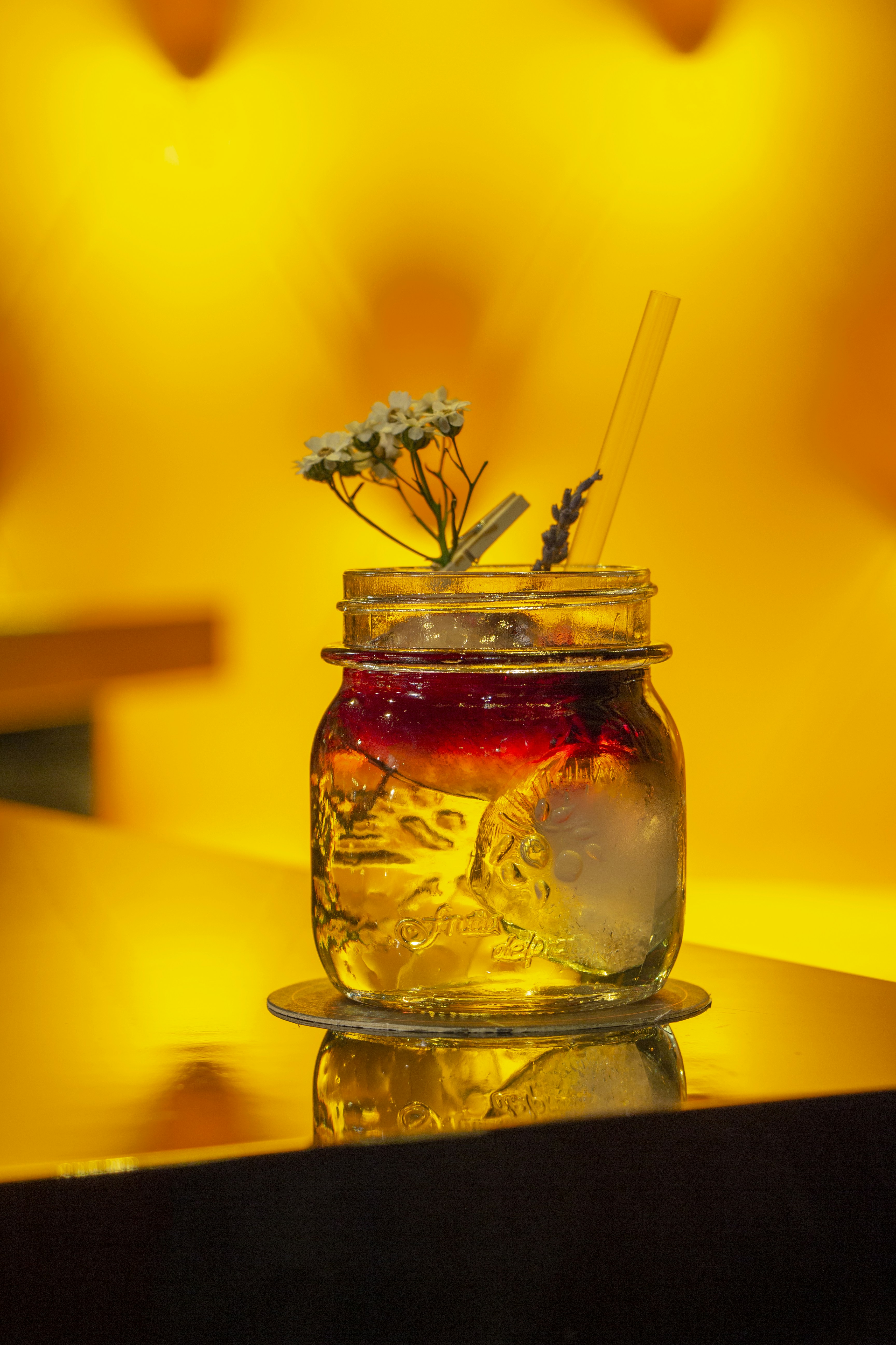 clear glass jar with brown liquid