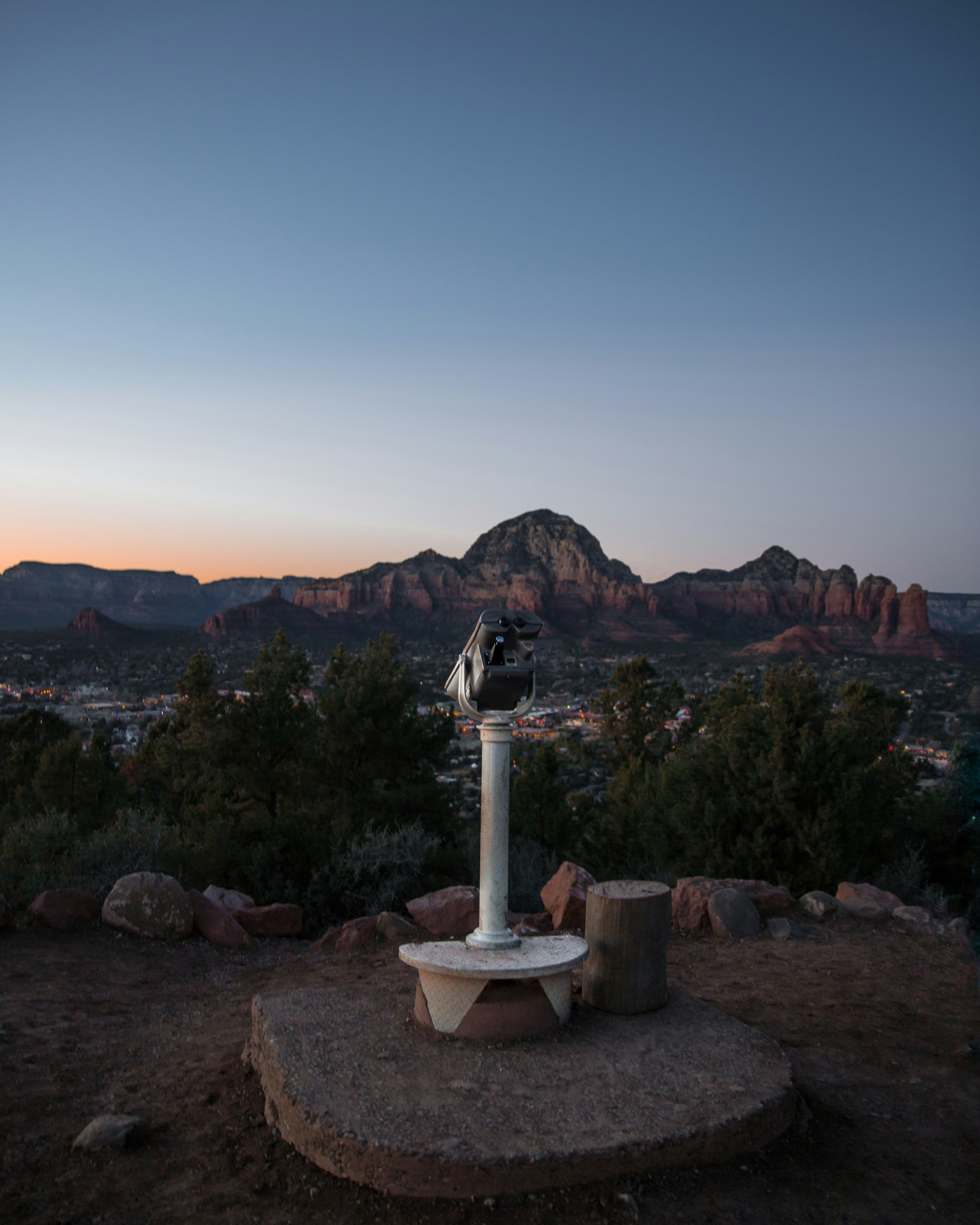 A Night-View Telescope Seated Above the Desert Town