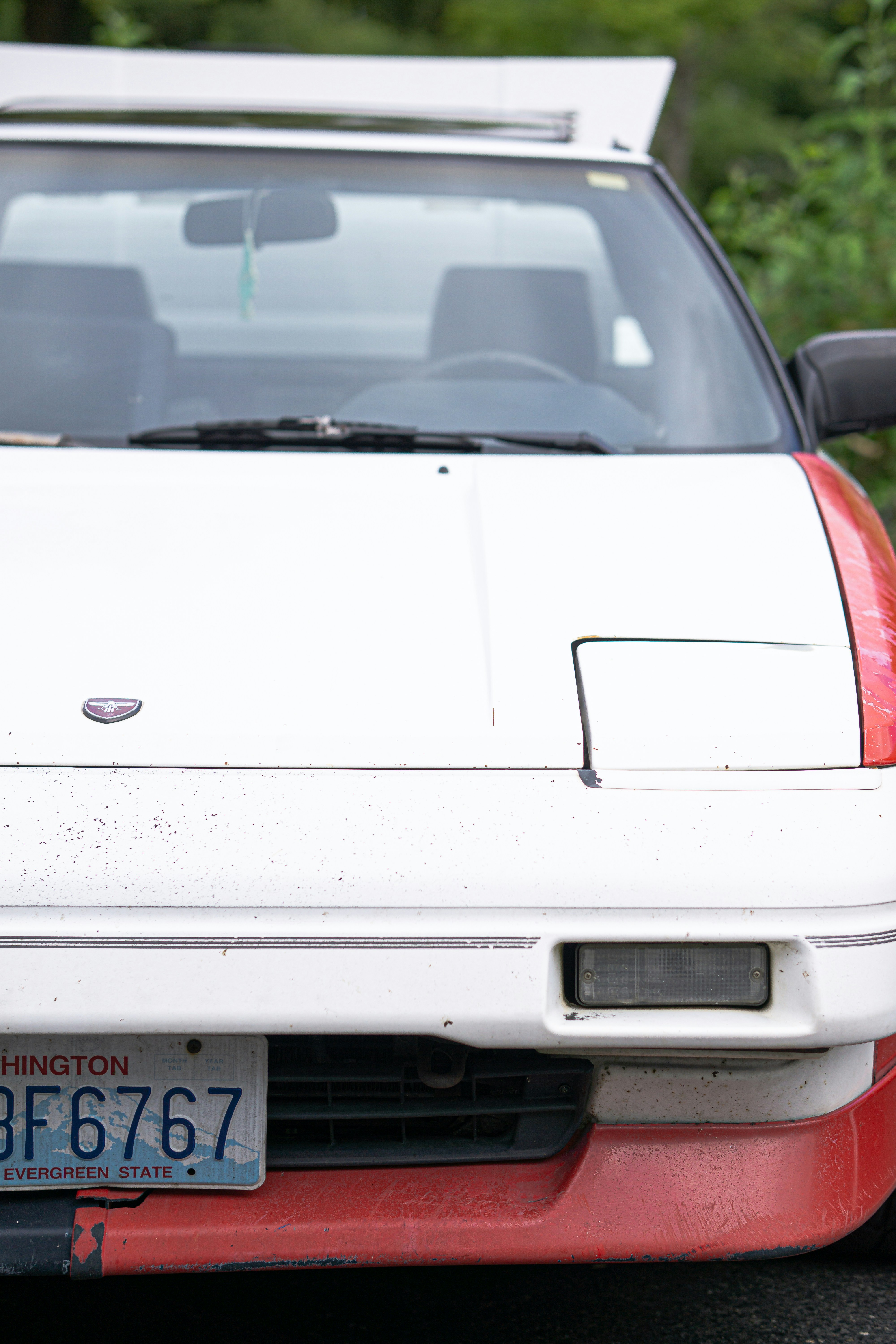 Front-End Portrait: White Hatchback with a Red Lip and a Washington Plate