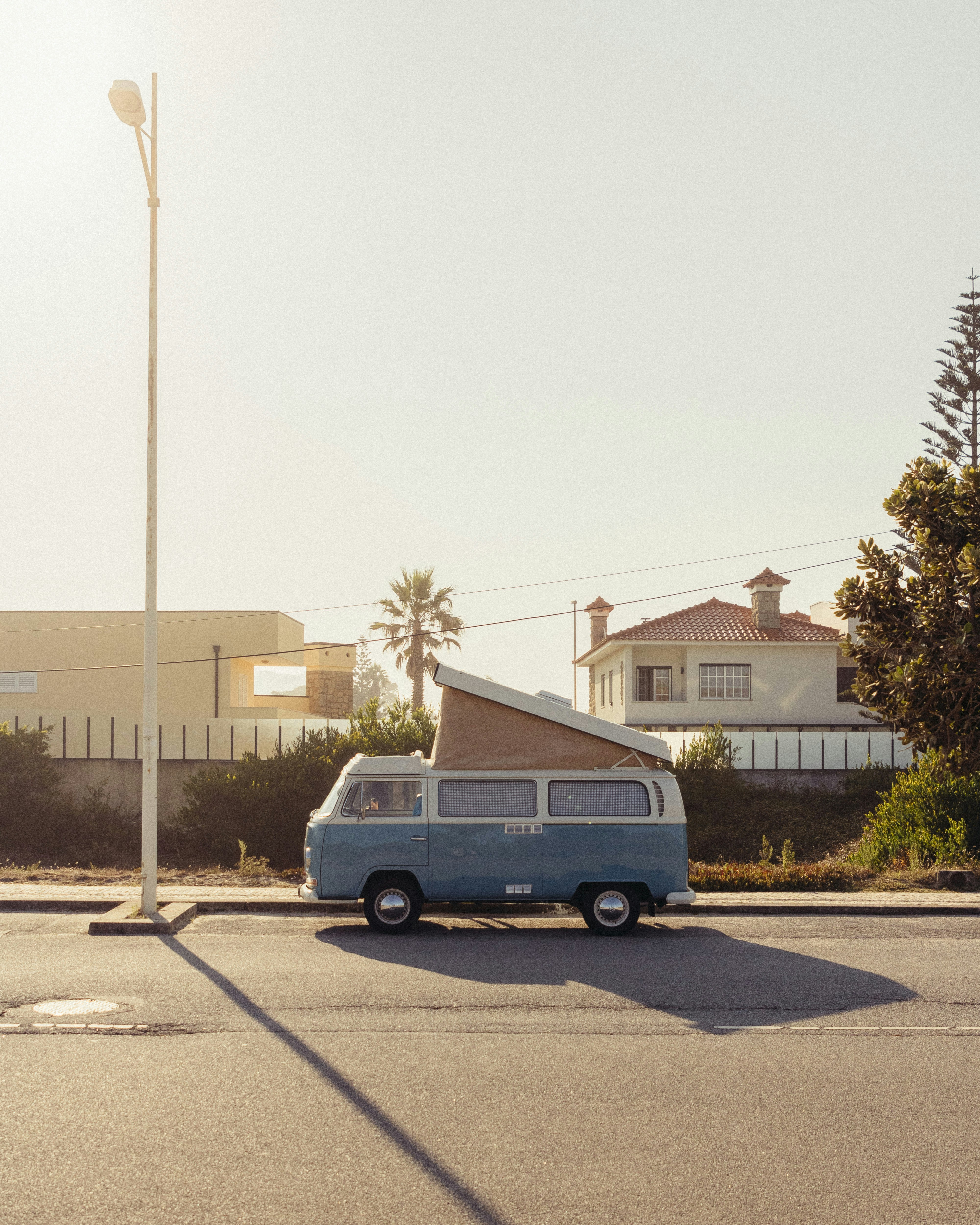 Blue van parked on gray concrete road during daytime photo – Free ...