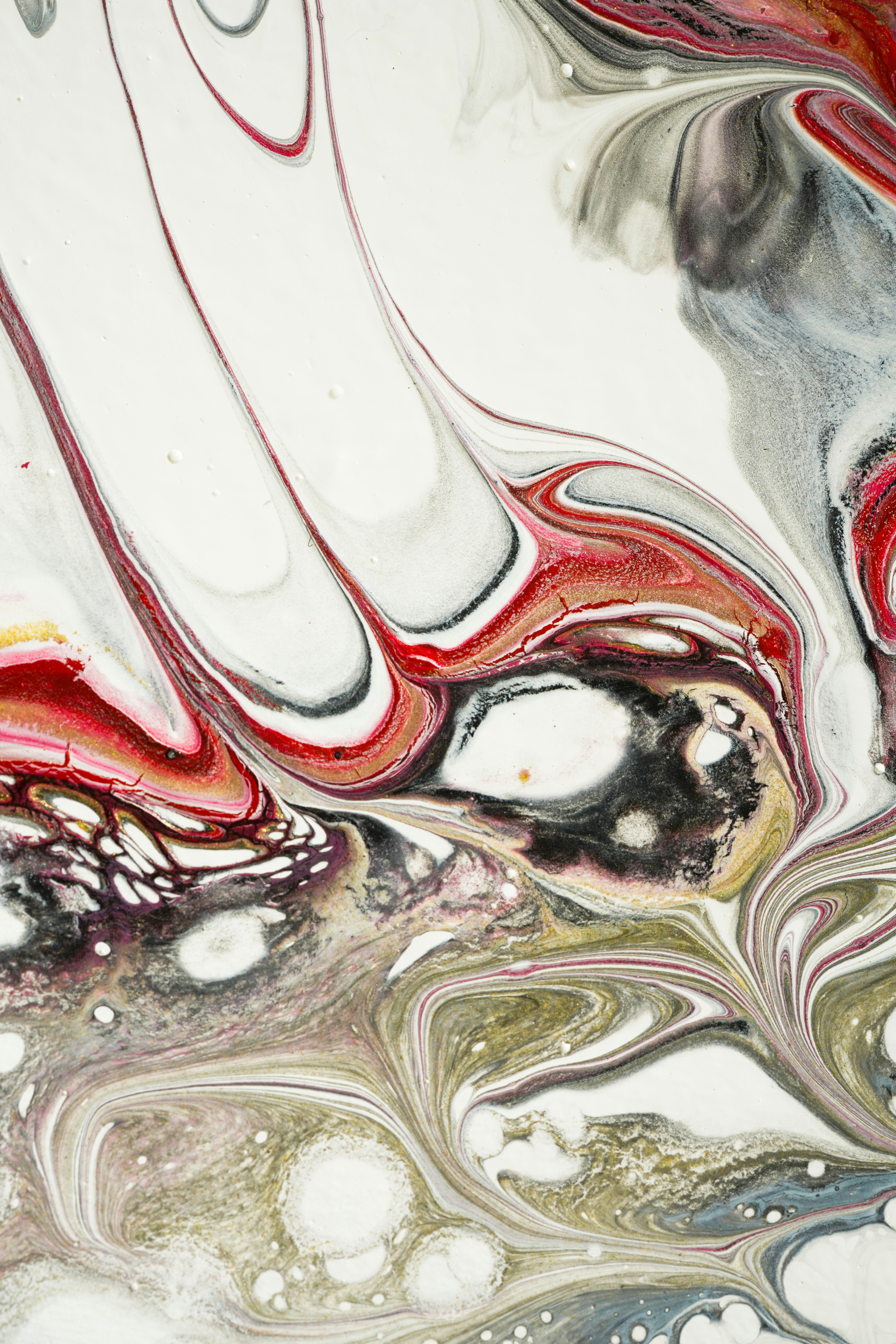 A close up of an abstract painting with red, white, and grey colors ...