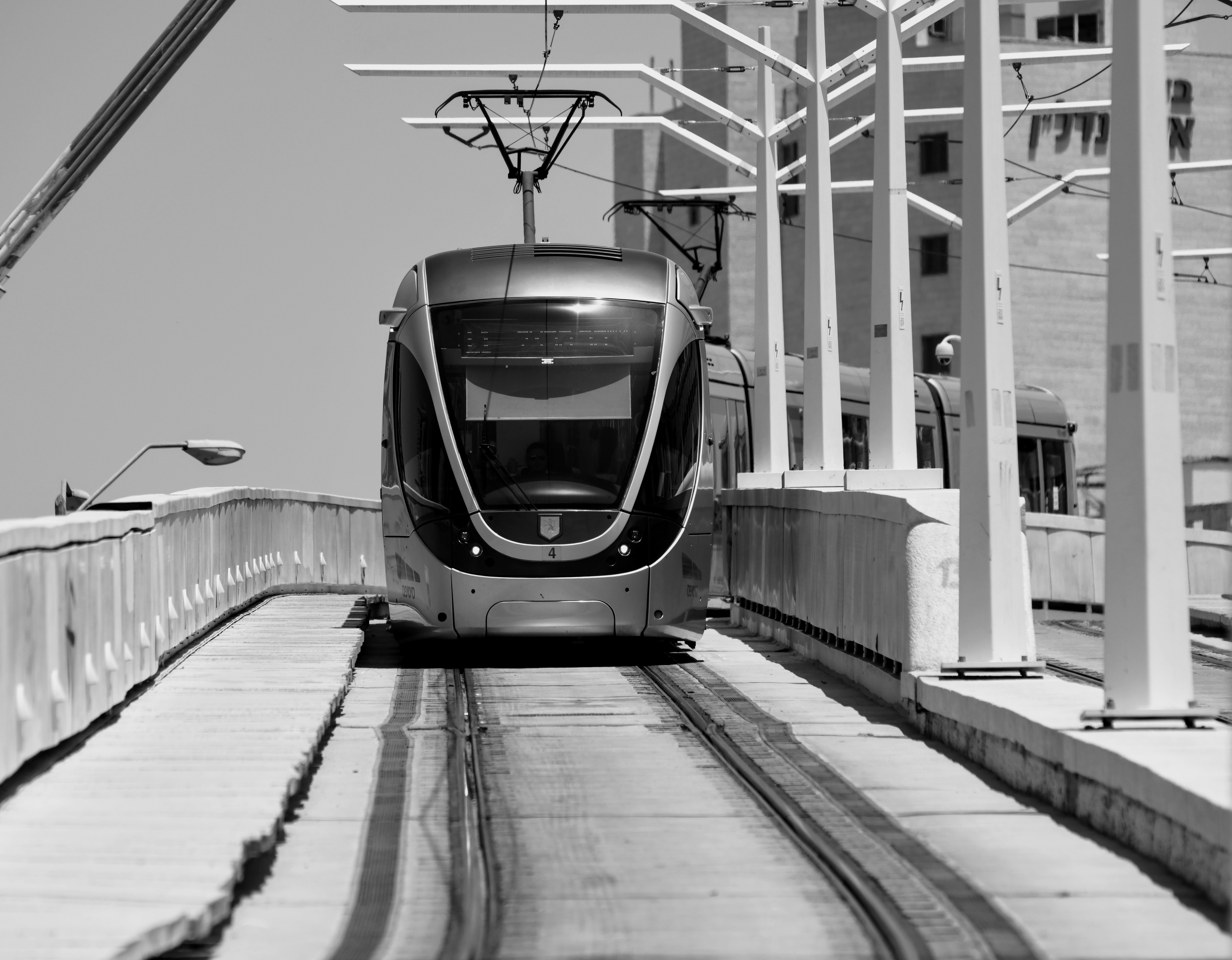 Apex of Transit: Front View of a Sleek Tram at a Minimalist Station