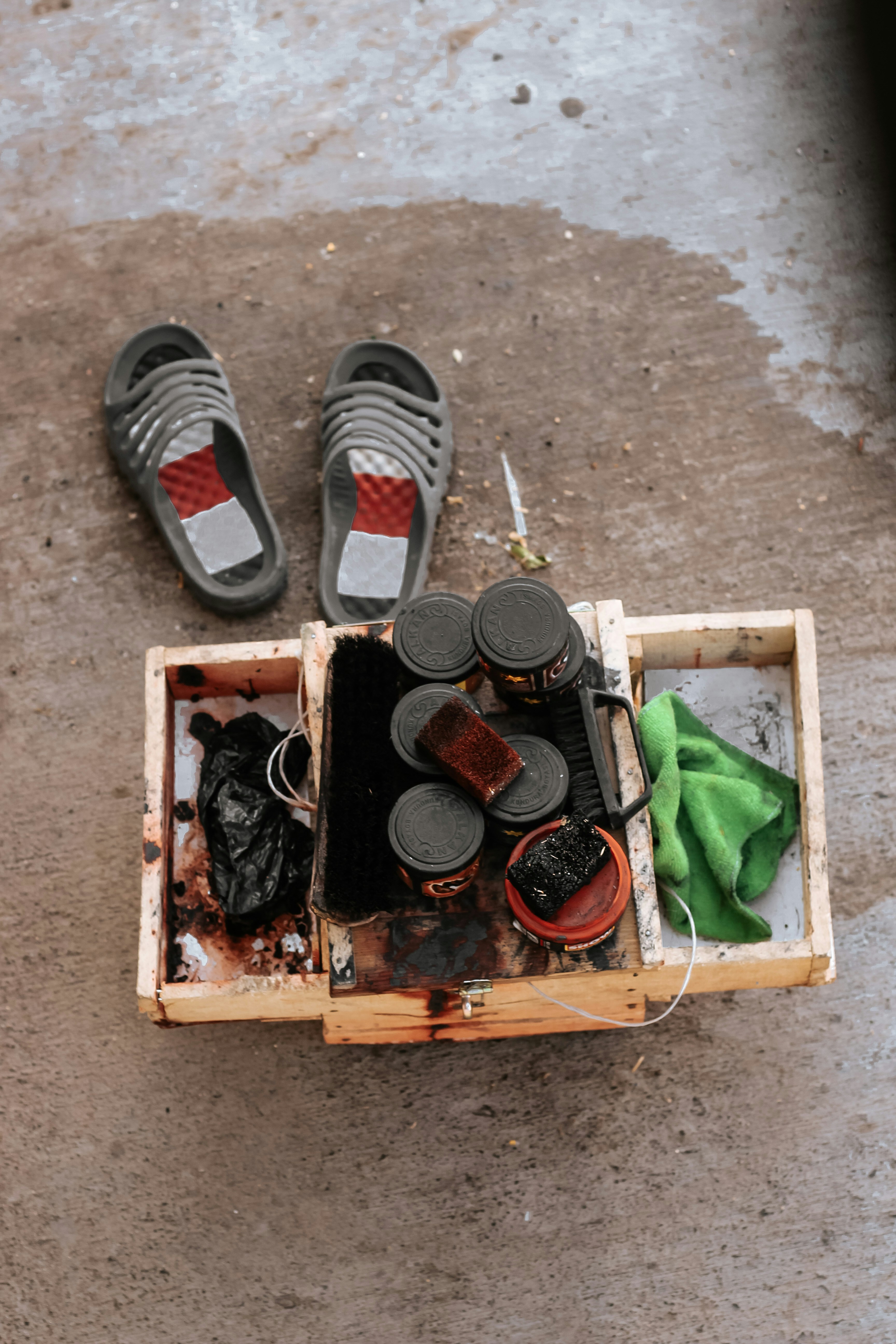 Paint-Splattered Crate and Weathered Sandals: A Quiet Workshop Moment