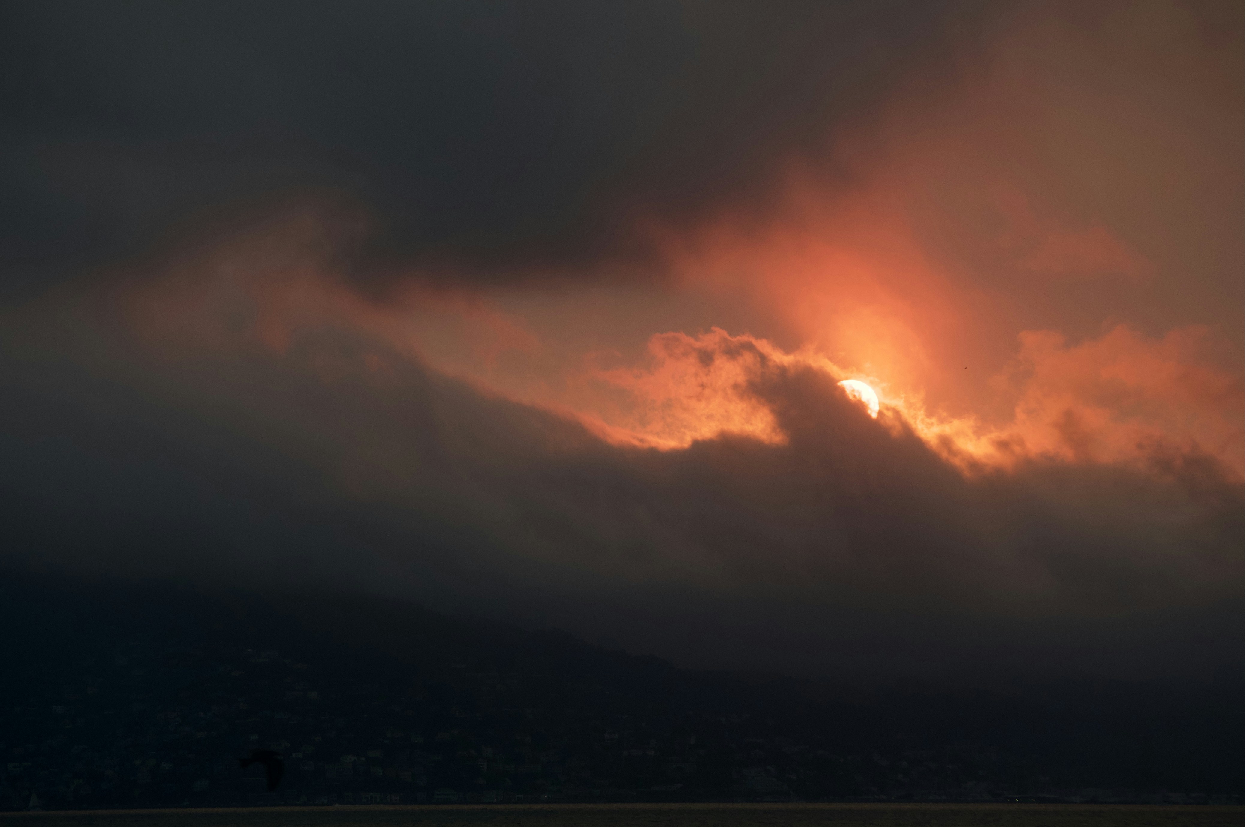 Sunburst Through the Storm: Veiled Coast at Dusk