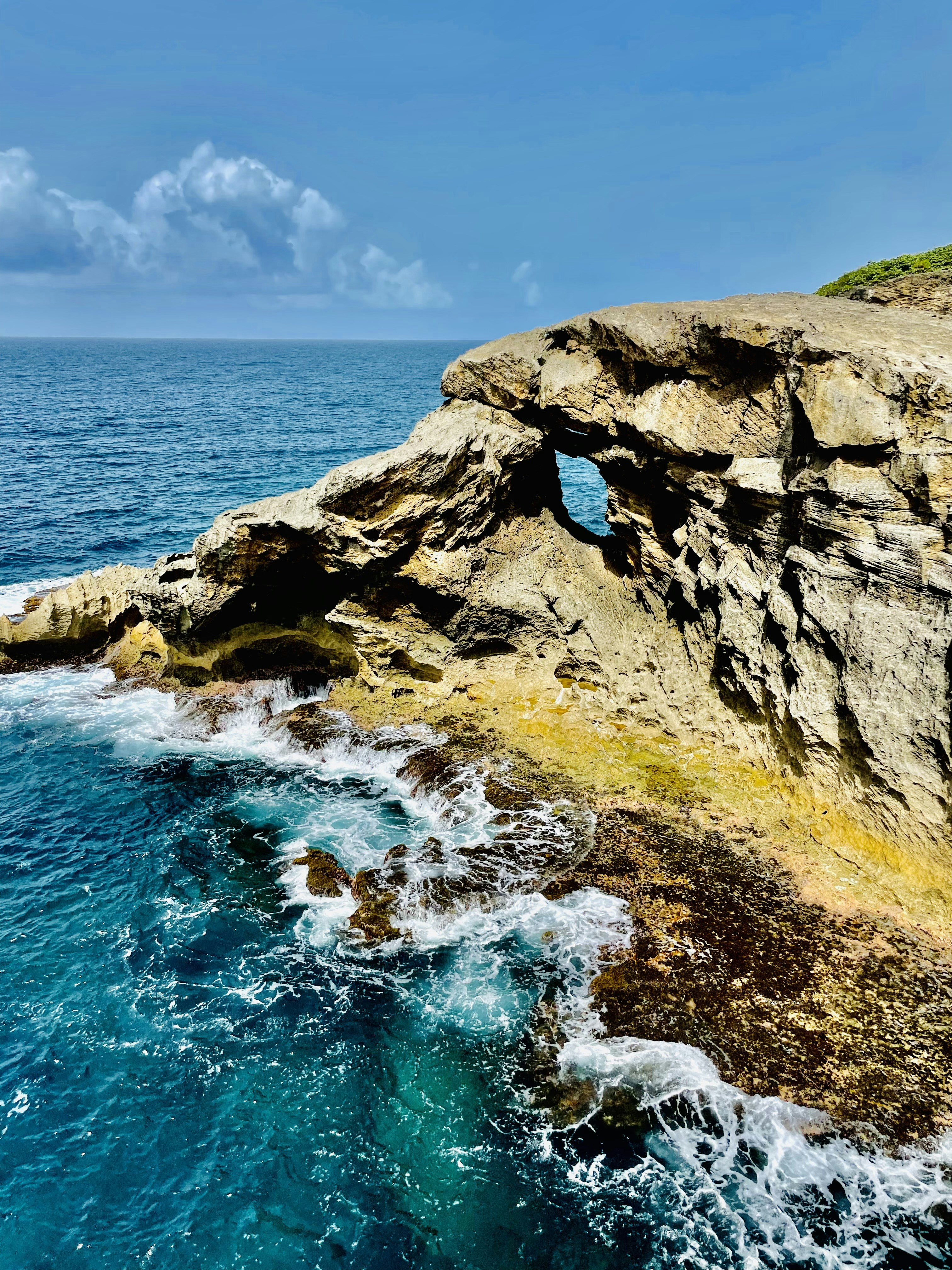 Sea Arch Overlook: A Wind-Worn Cliff Carved by Ocean Blues