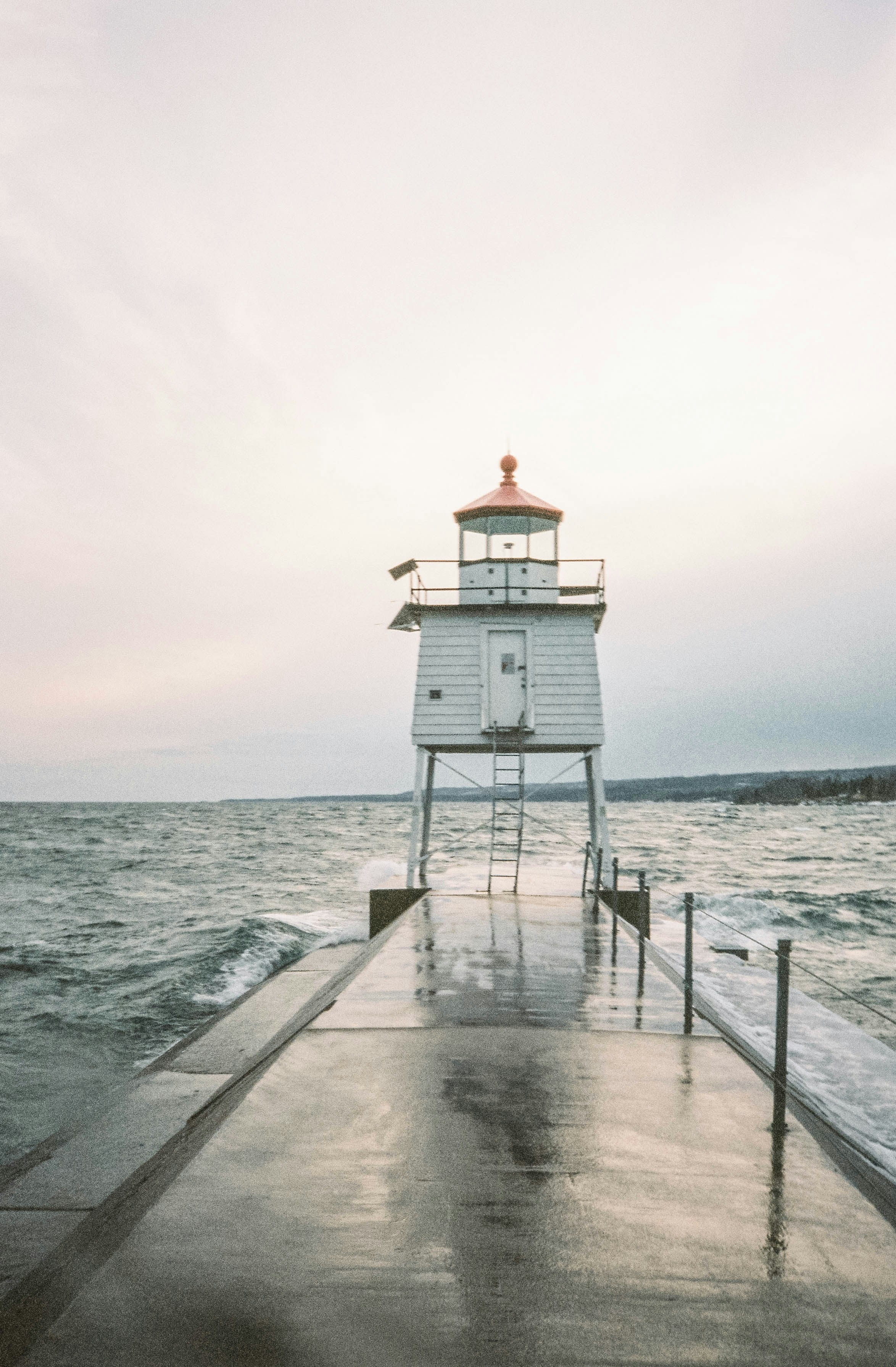 White and red wooden watch tower near sea during daytime photo – Free ...