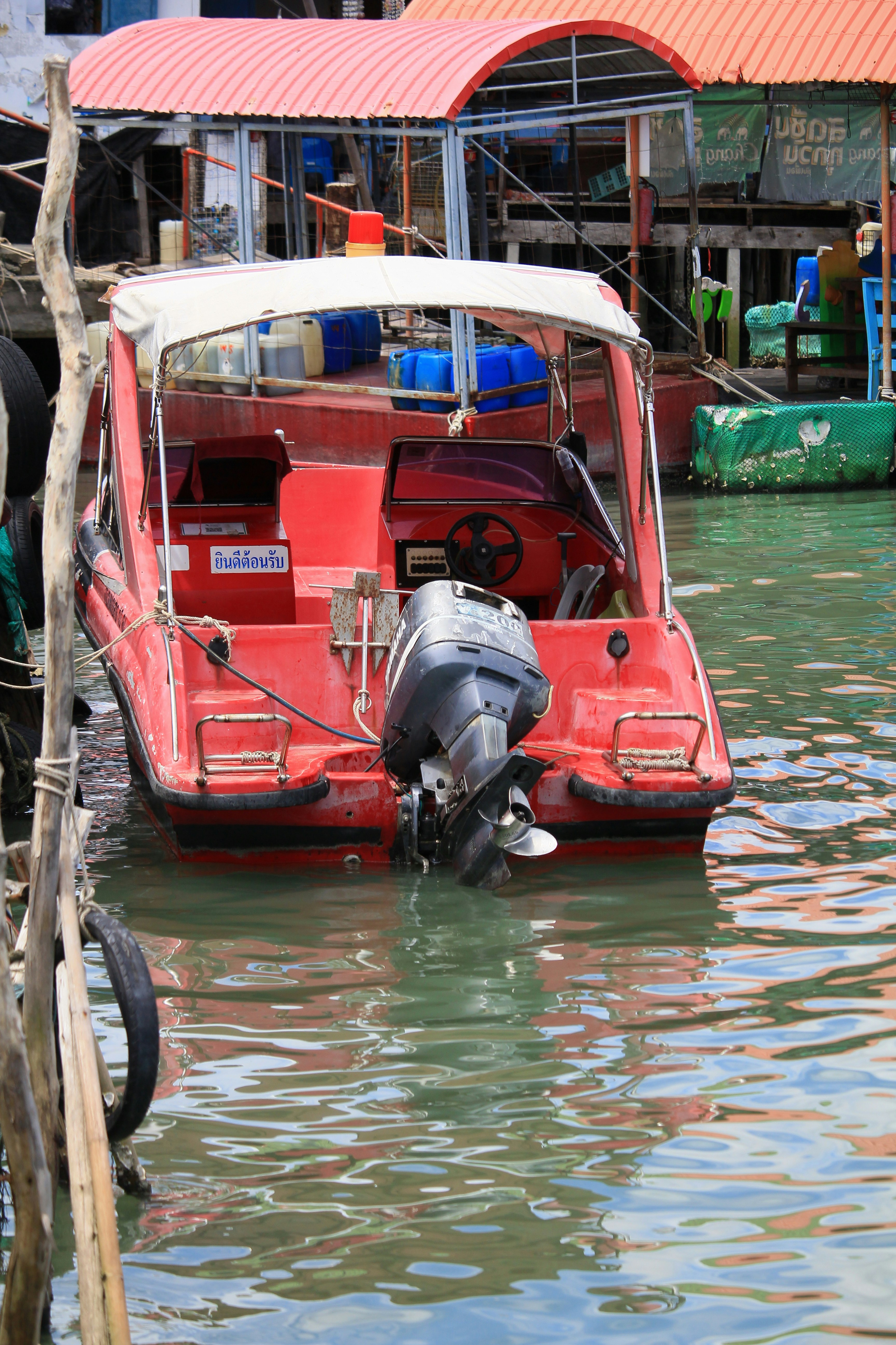 Red Boat at a Floating Market: Engine and Wake in Tactical Focus