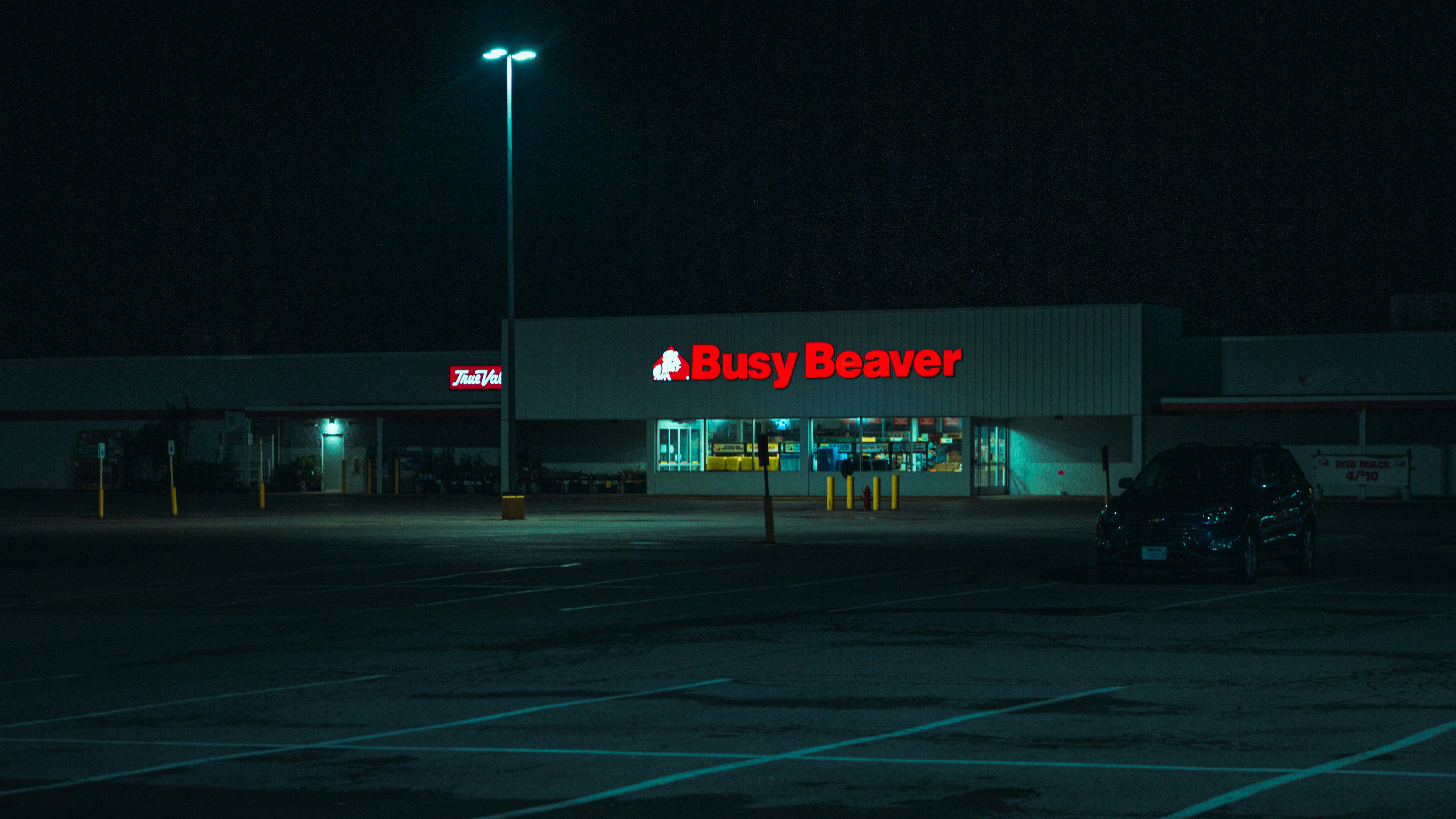 Red and white store signage during night time photo – Free Pa Image on ...