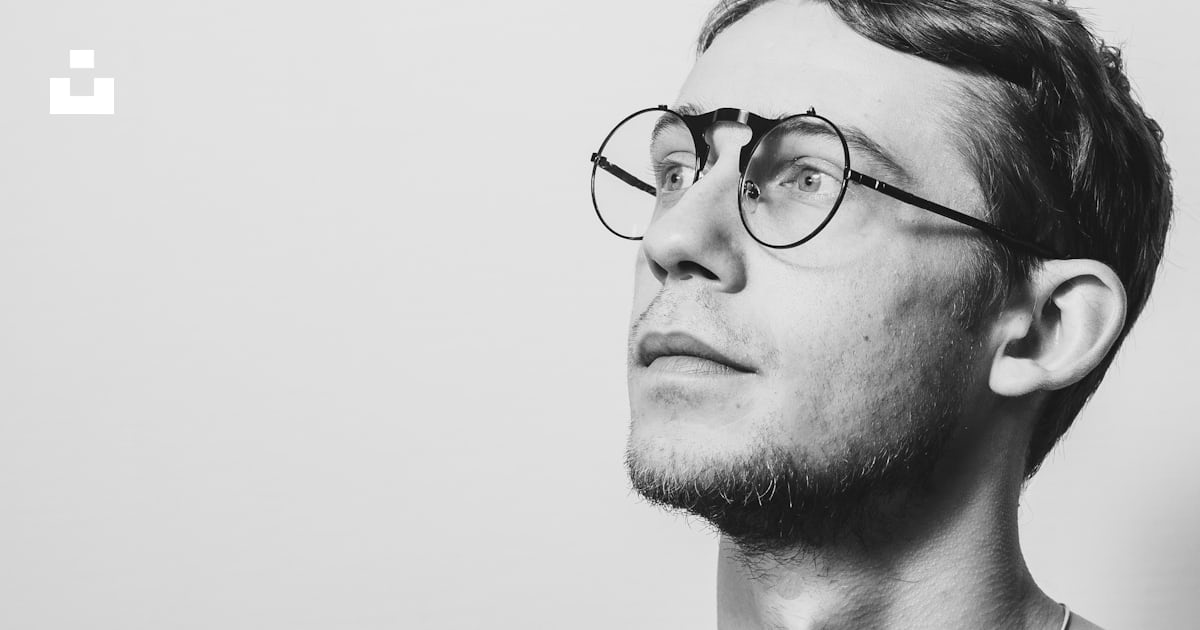 Man In Black Crew Neck Shirt Wearing Black Framed Eyeglasses Photo