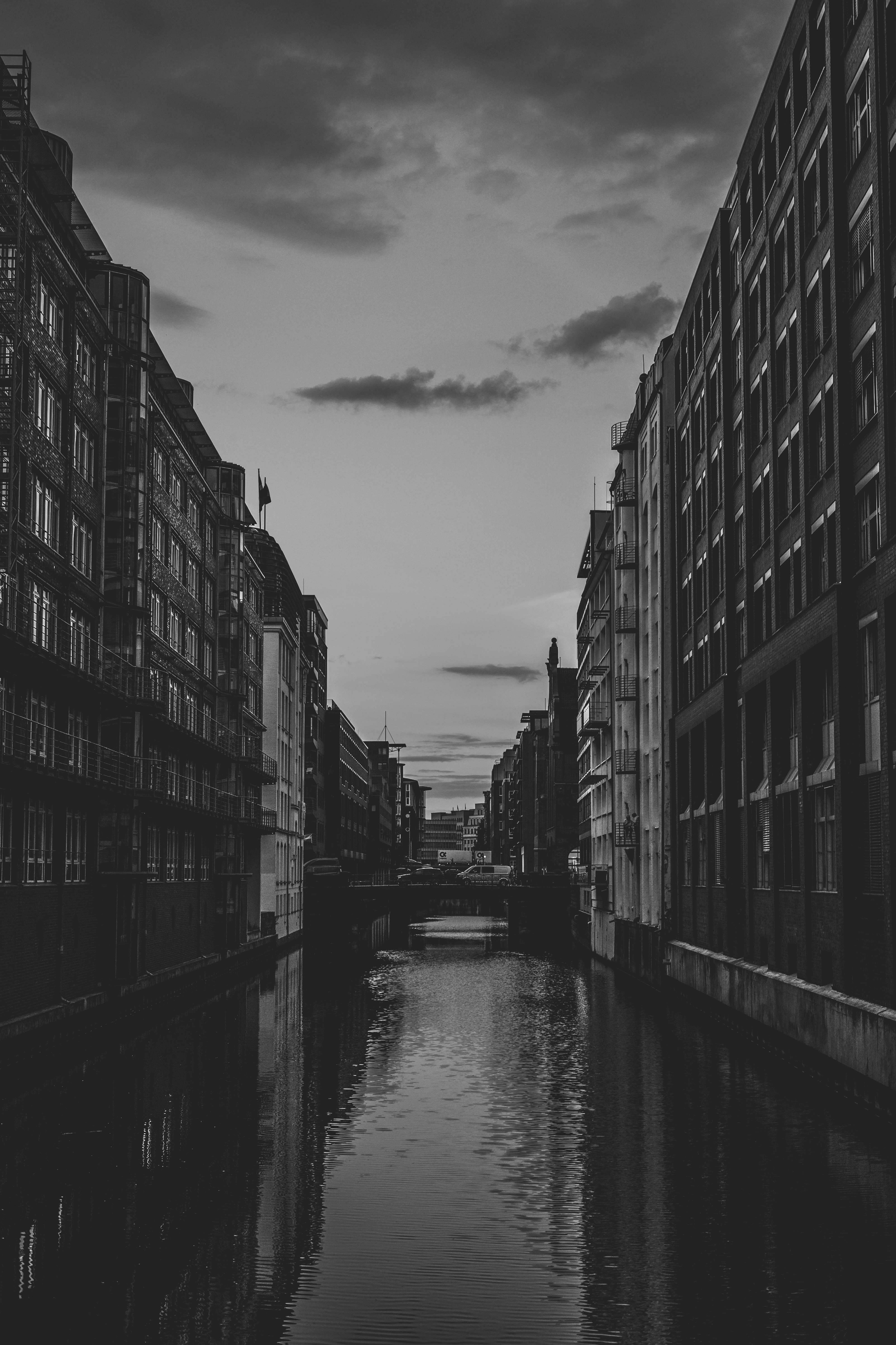 Grayscale photo of river between buildings photo – Free Grey Image on ...