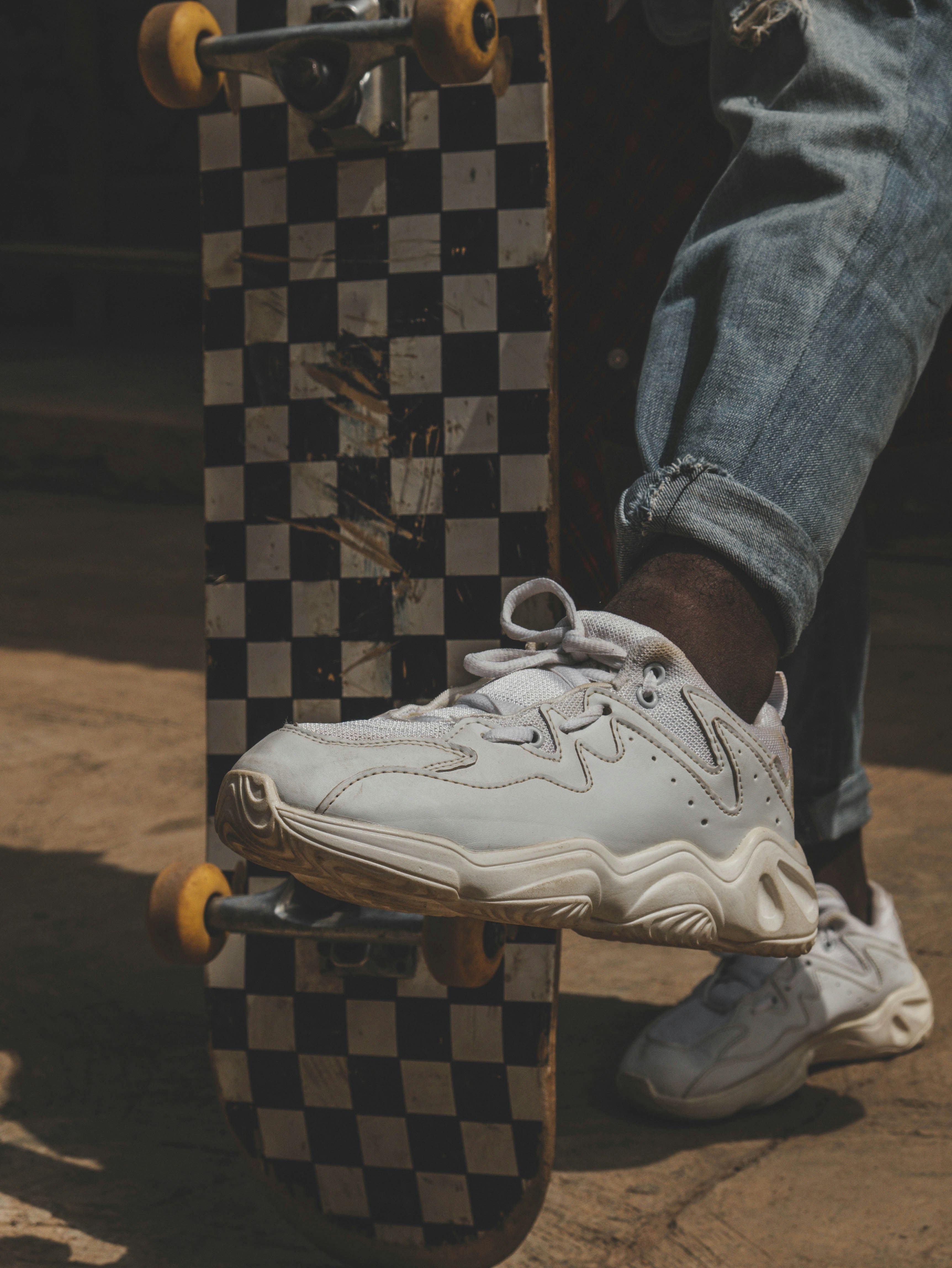 Photo of Happy skater Jumping on white trainers