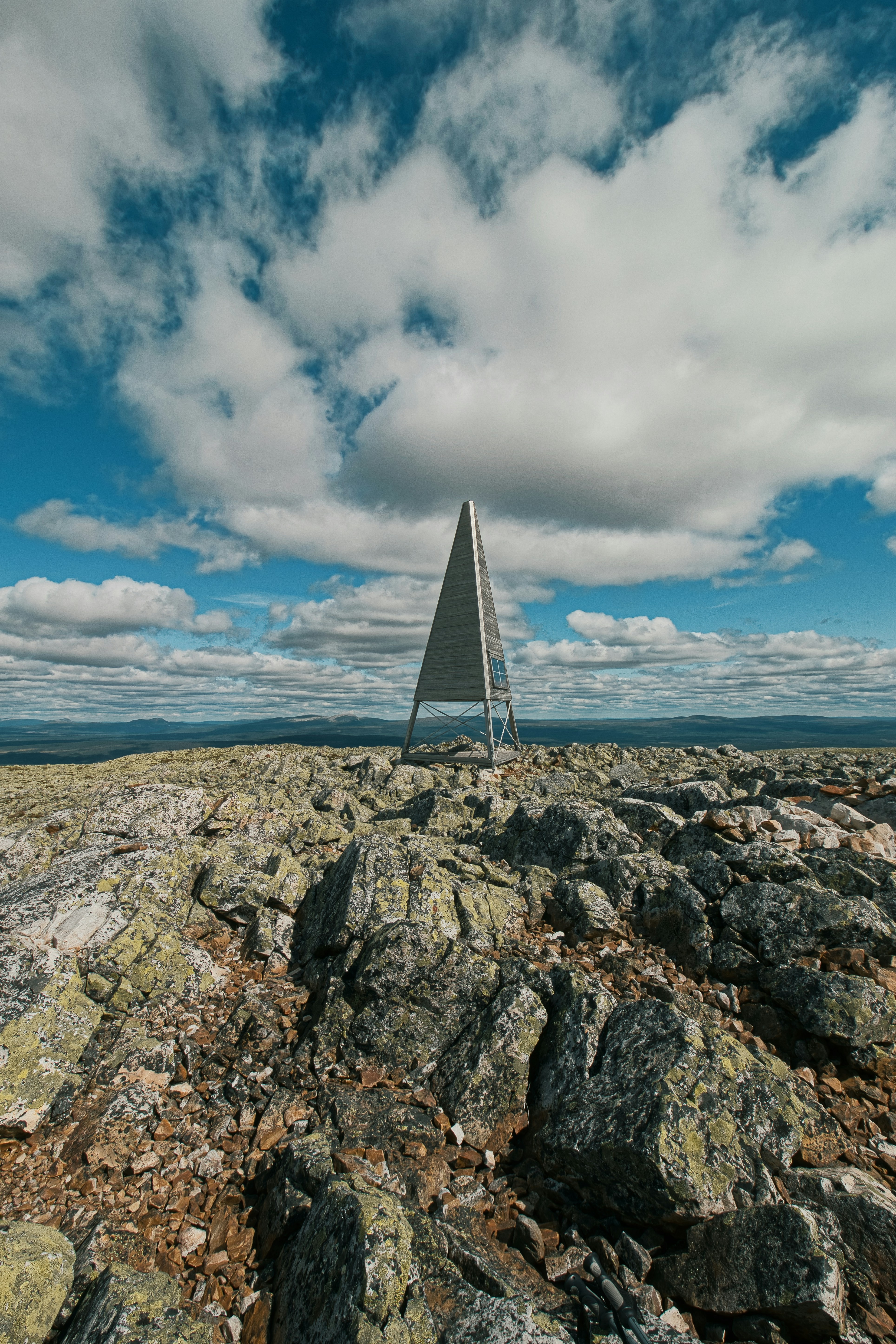 Sail of Stone: A lone triangular landmark adrift on rugged alpine basalt