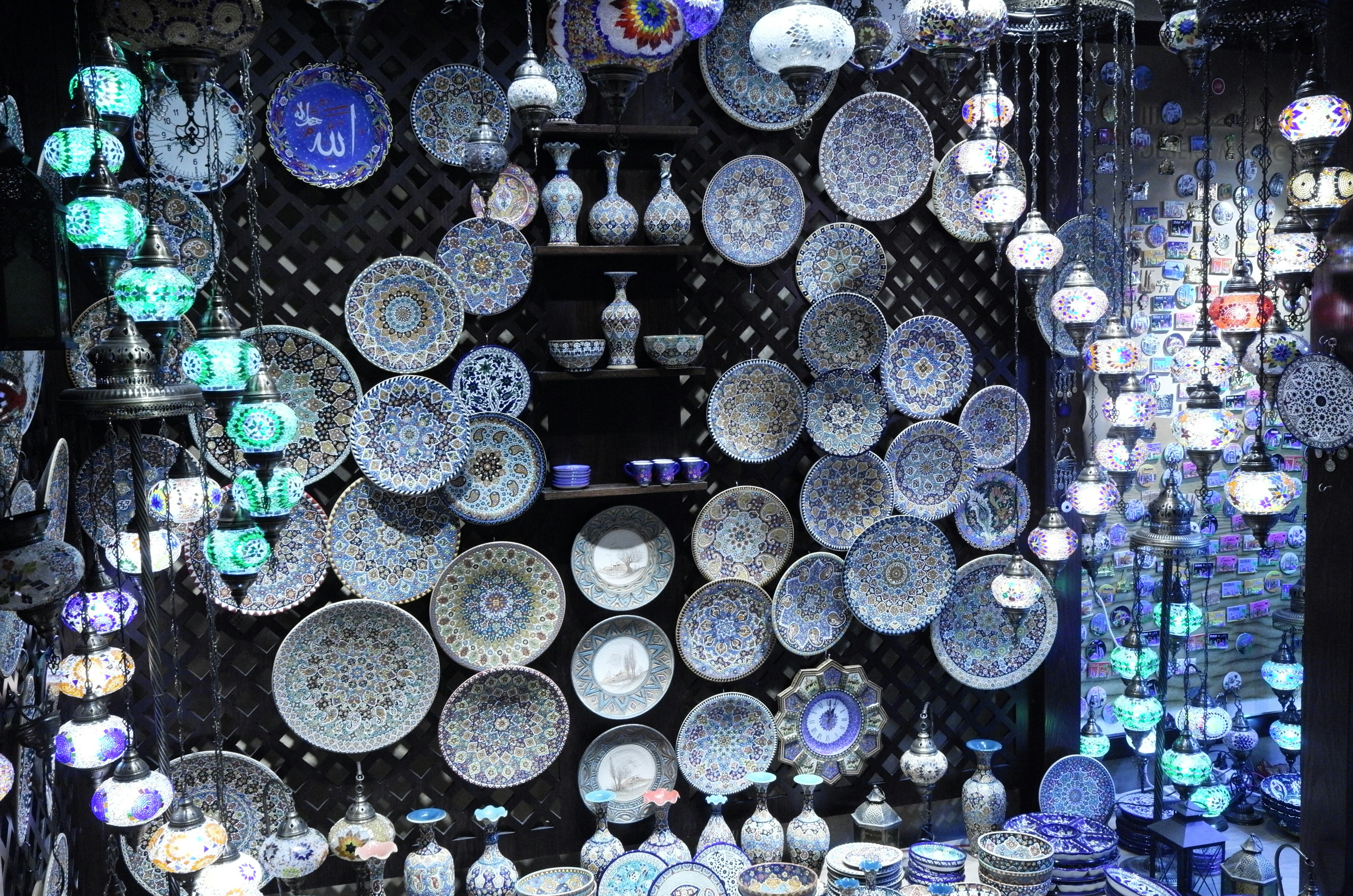 Ceramic constellation: a gallery of blue and white plates framing a mysterious shelf